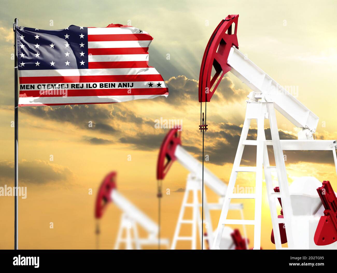 Oil rigs against the backdrop of the colorful sky and a flagpole with ...