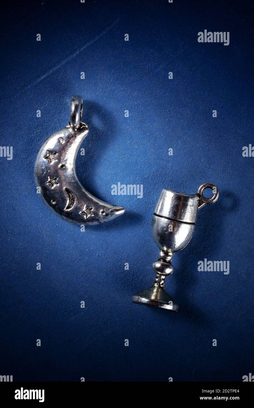 The Moon and the Cup, symbols of a pagan witchcraft ritual, a flatlay ...
