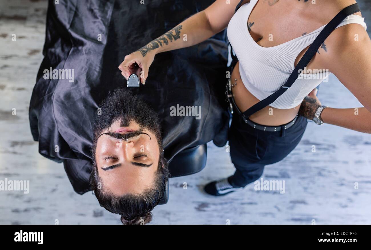 Female barber shaving hi-res stock photography and images - Alamy