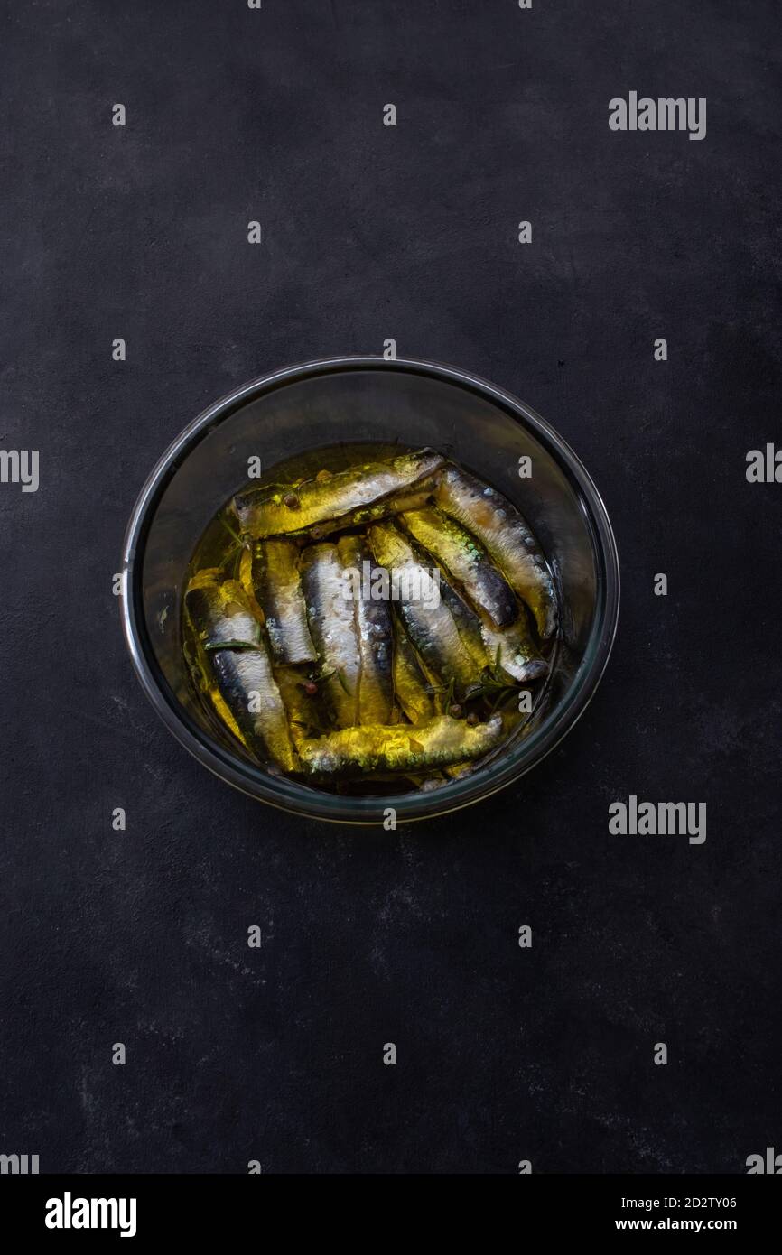 Top view of heap of delectable marinated sardine fish with aromatic ...