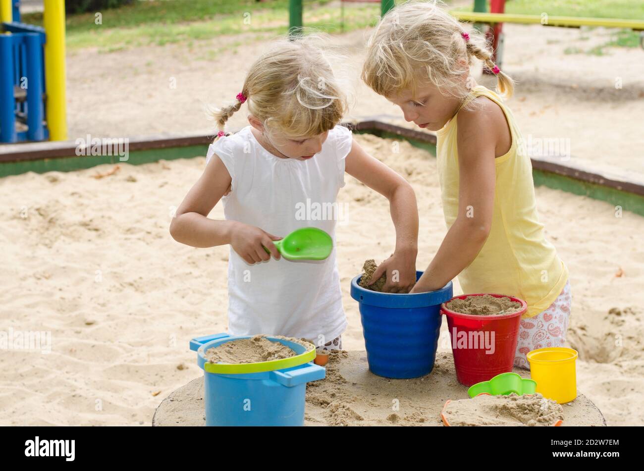 Girl playing in sand pit hi-res stock photography and images - Alamy