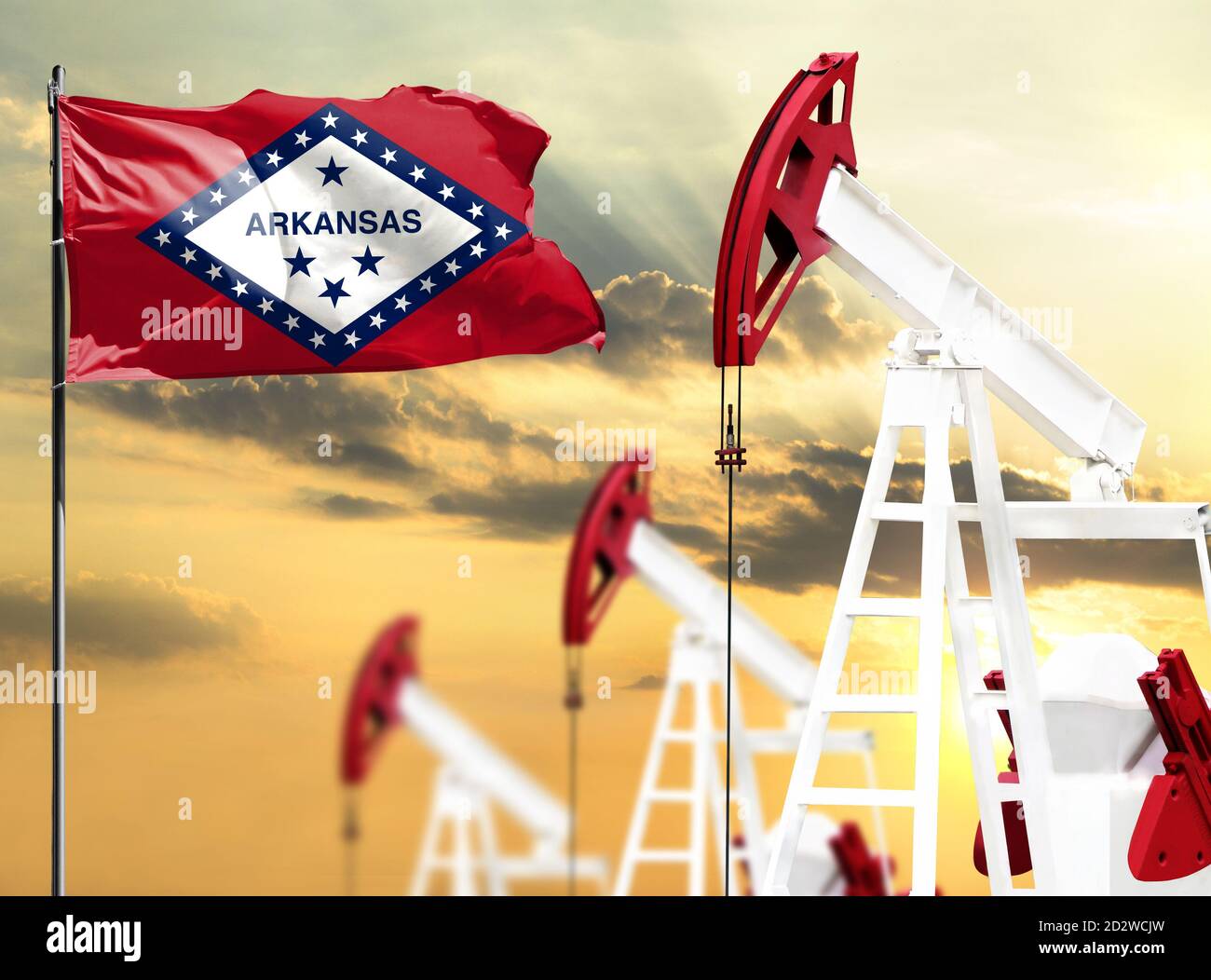 Oil rigs against the backdrop of the colorful sky and a flagpole with ...