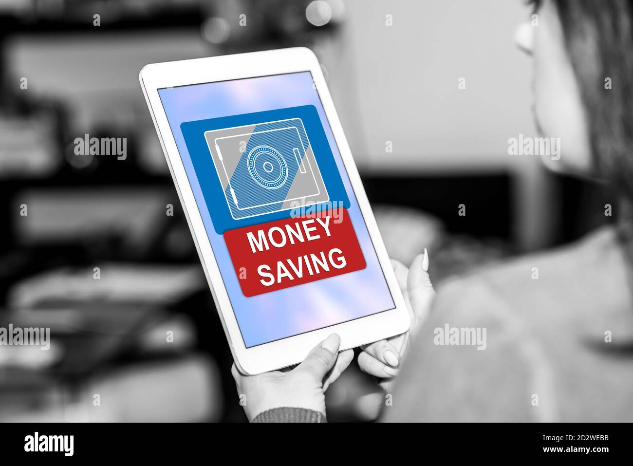 Tablet screen displaying a money saving concept Stock Photo - Alamy