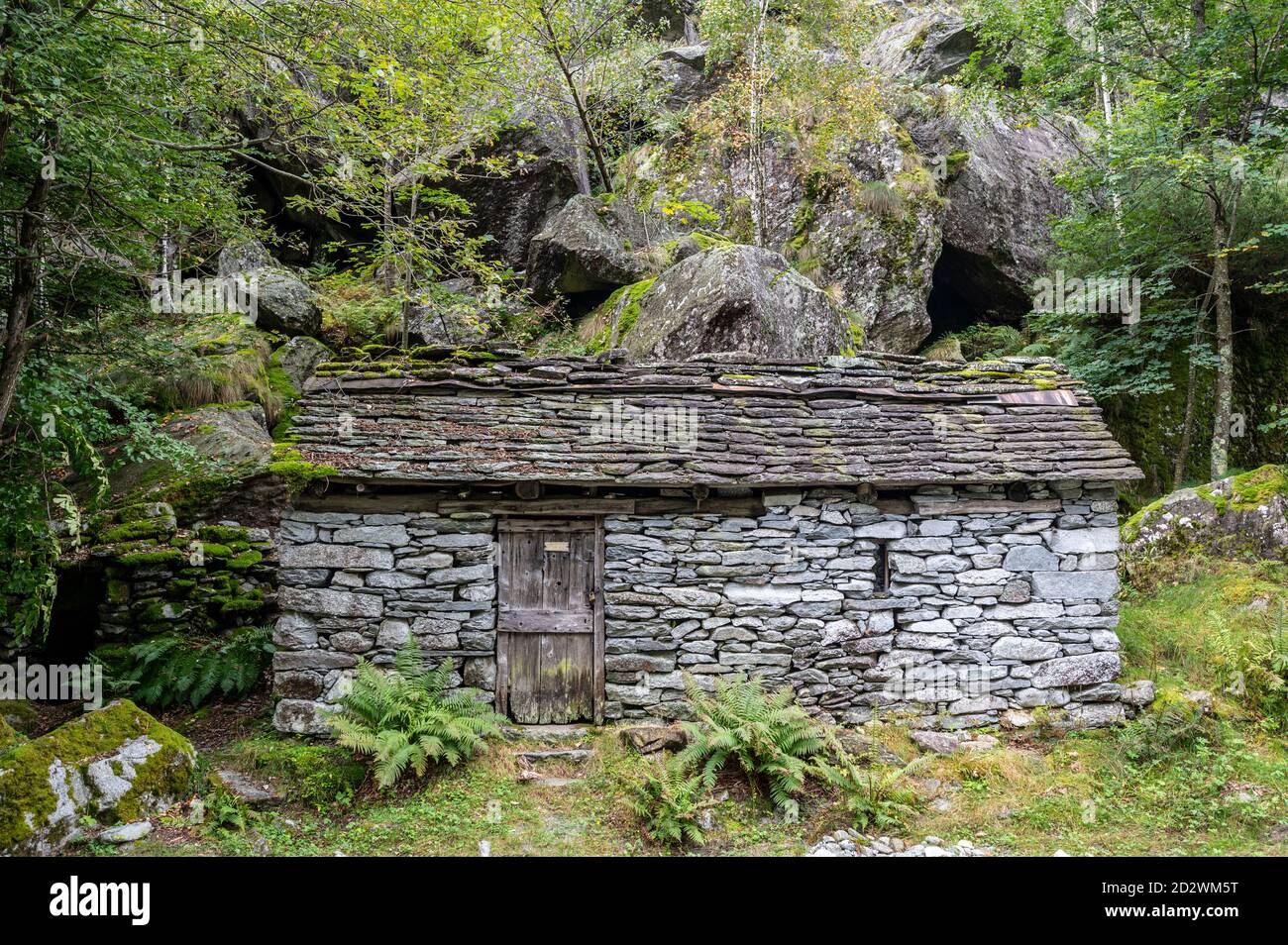 Traditional stone hut on Calnegia River trail near hamlet of Foroglio ...