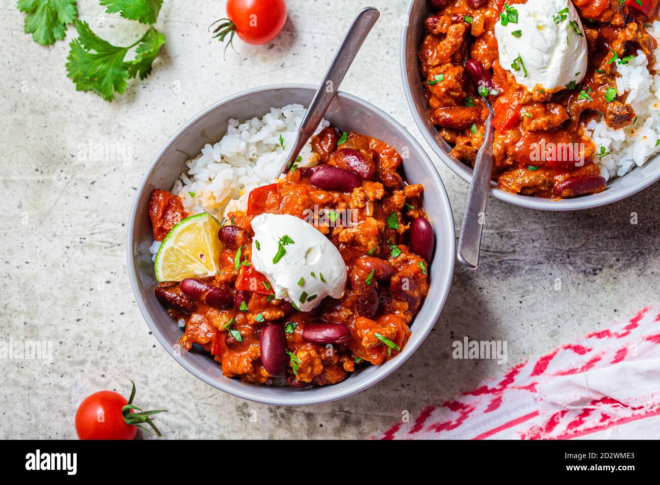 Chili con carne with rice in a gray bowl. Beef stew with beans in ...