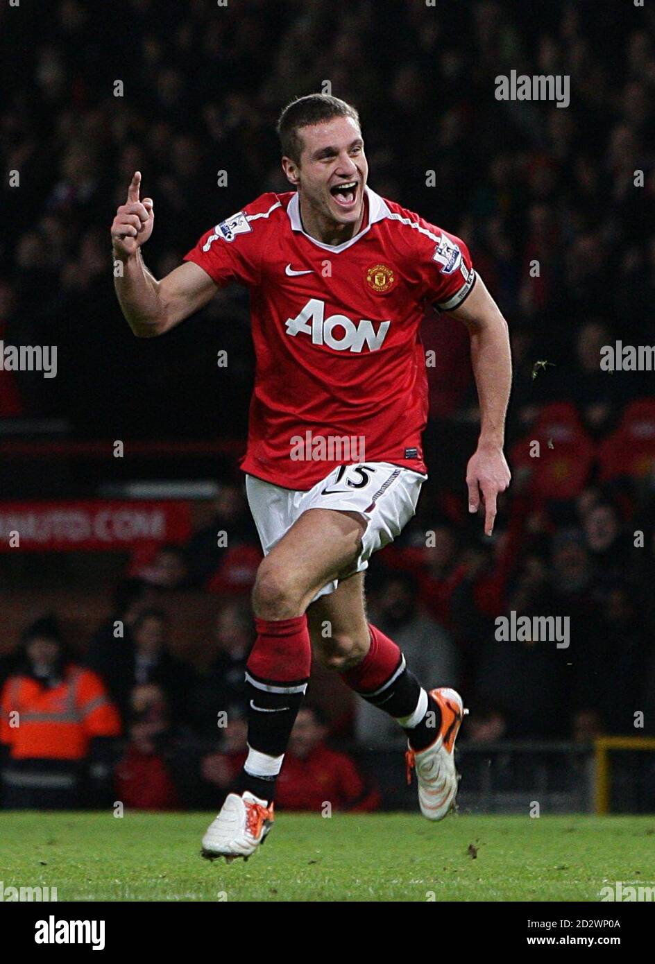 Manchester United's Nemanja Vidic celebrates scoring their third goal ...