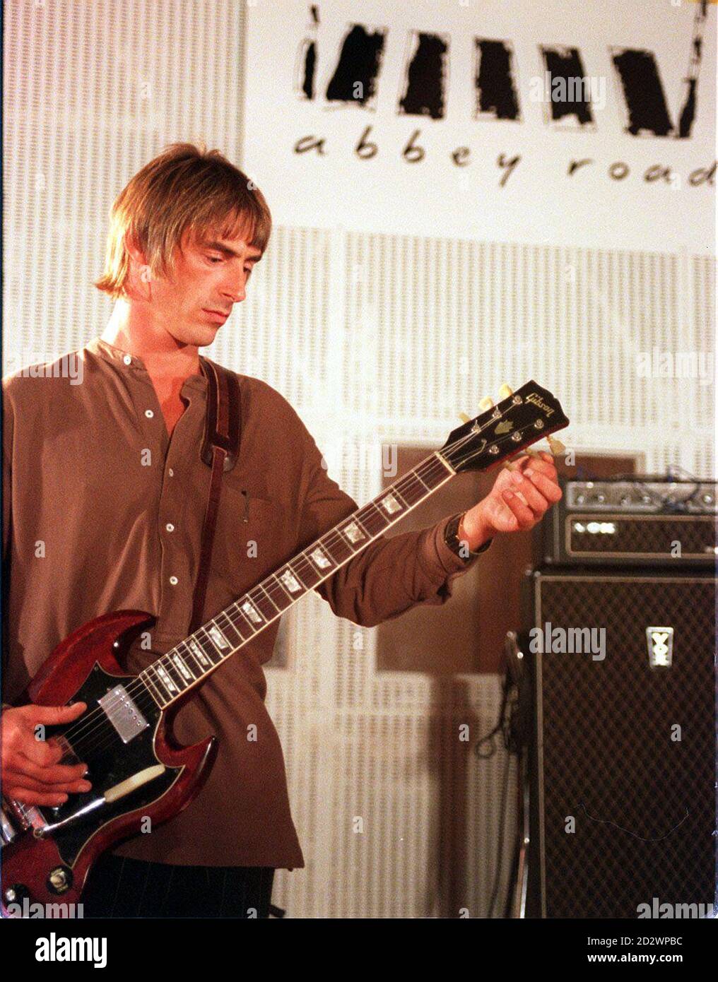 Pop star Paul Weller tunes up before he and some of Britain's top pop ...