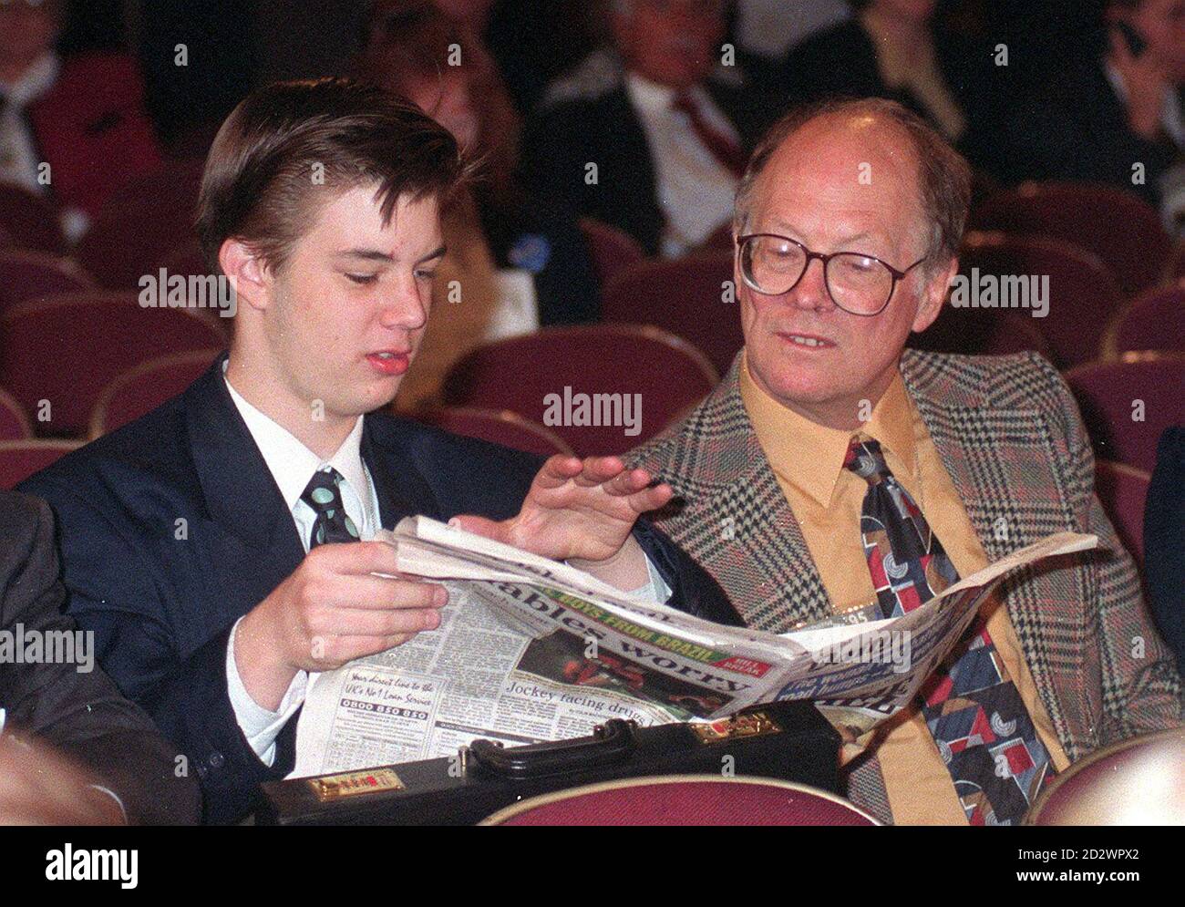 Justin Hinchcliffe, 14, discusses an article in a newspaper with a ...