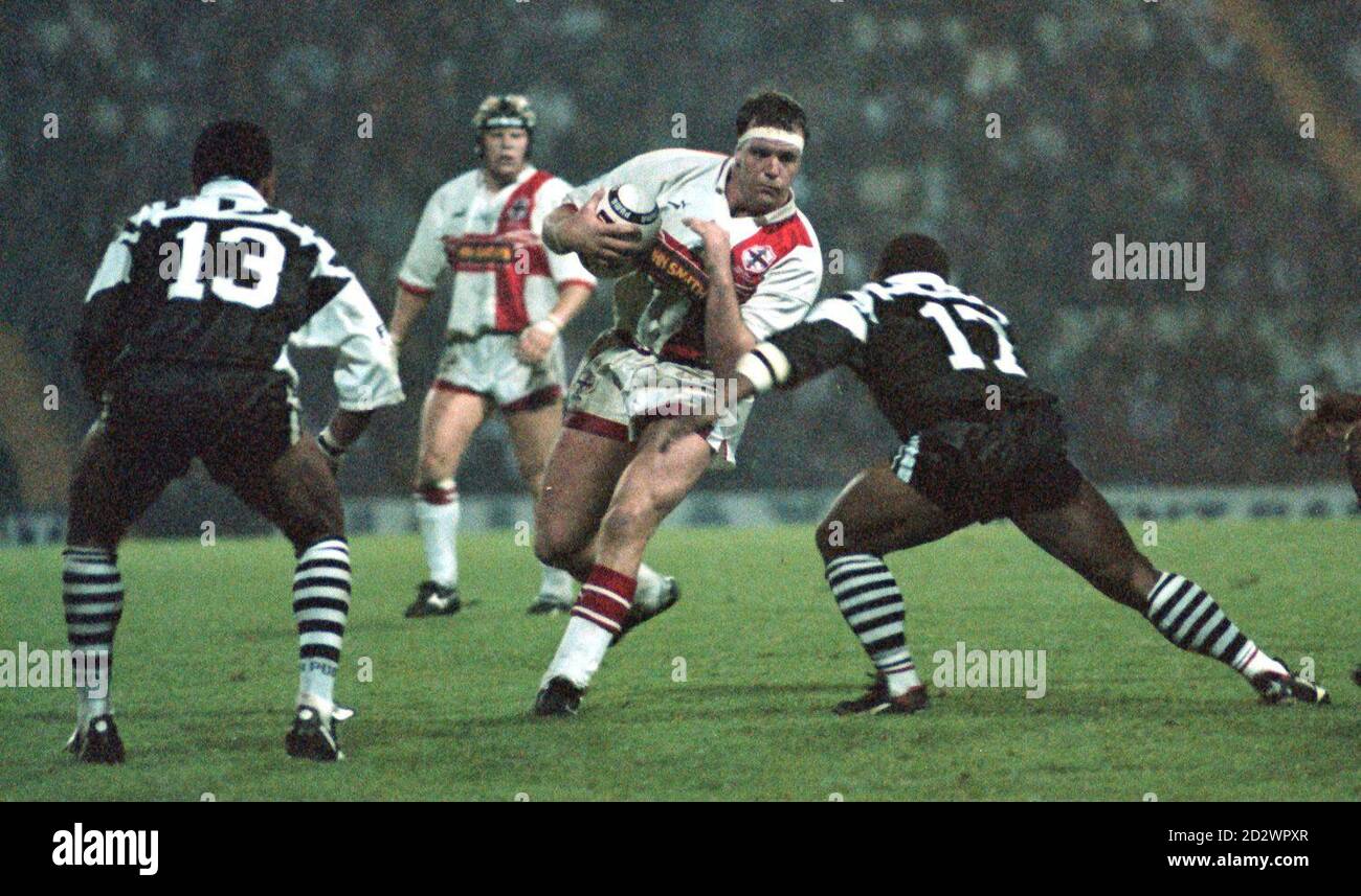 Englands paul broadbent ploughs through fijian dfence hi-res stock ...