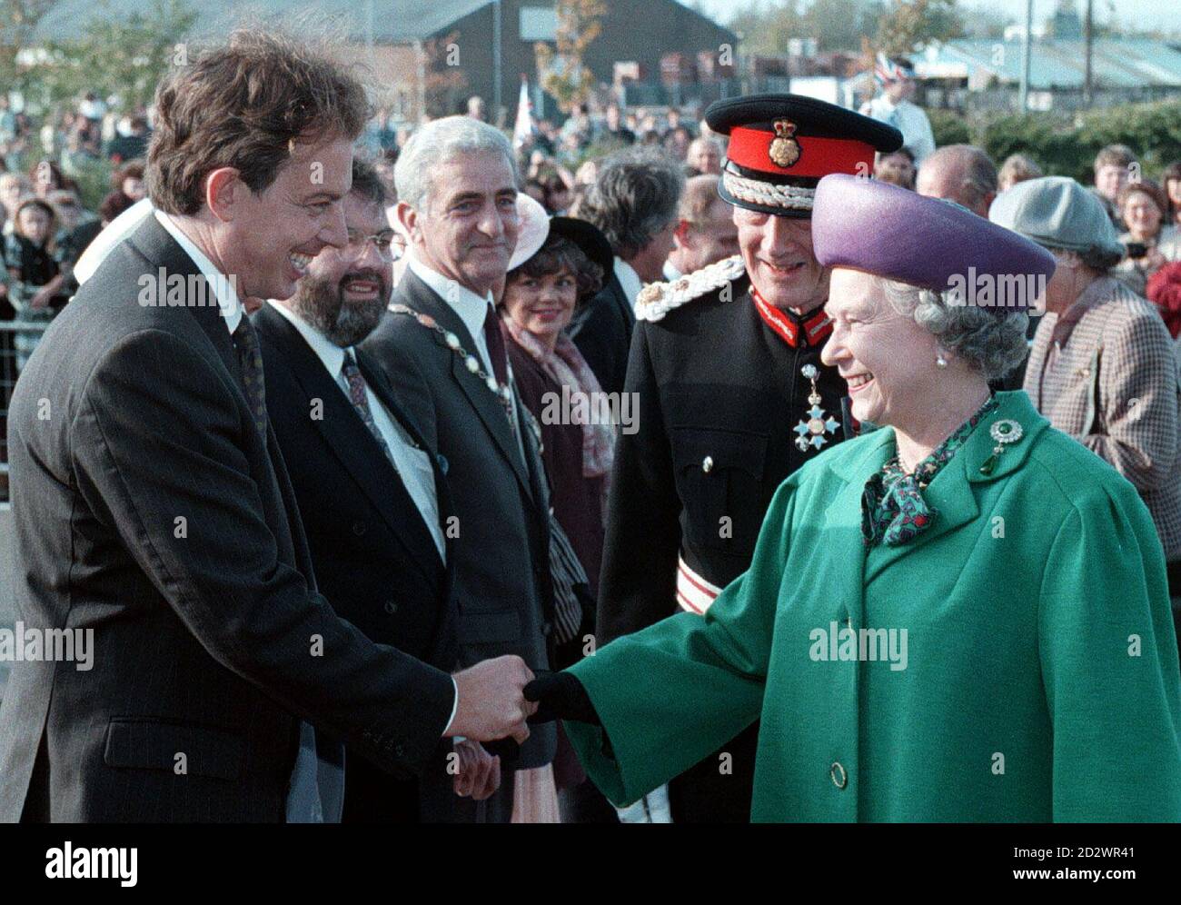 The Queen shakes hands with Labour leader Tony Blair outside the Thorn ...
