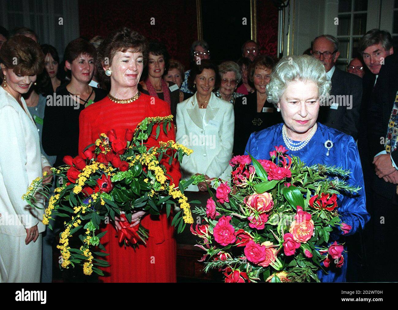 The Queen and Irish President Mary Robinson receive flowers at St James ...