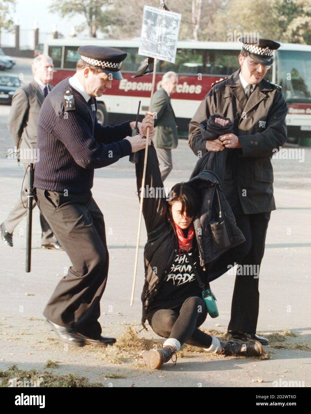 Police remove protester Jen Parker from Sandown Park during a ...