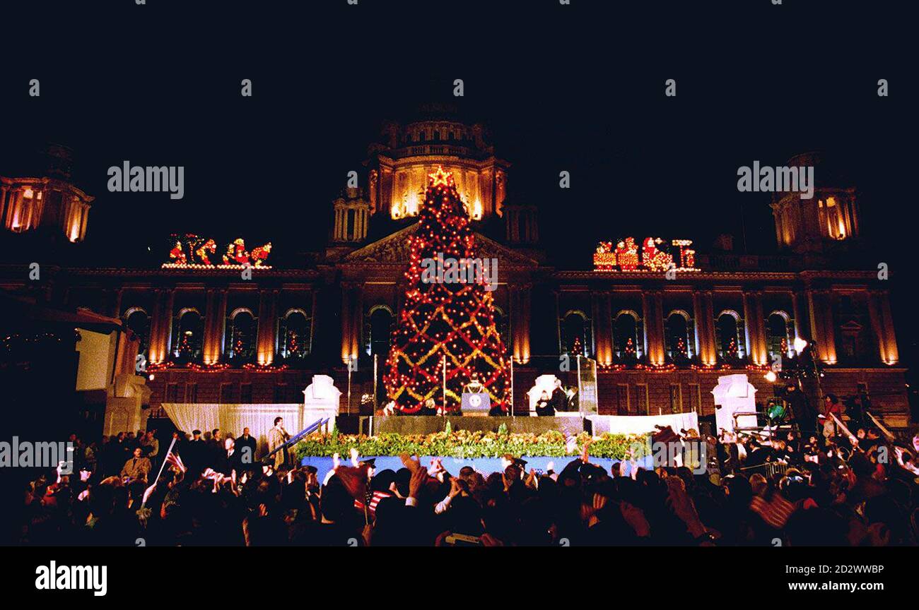 US President Bill Clinton turns on the lights at Belfast city hall this ...