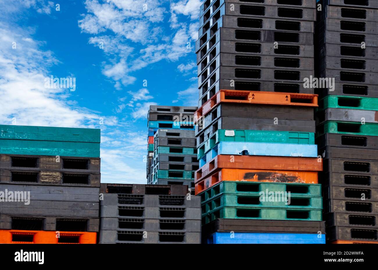 Pile of plastic shipping pallet. Industrial plastic pallet stacked at ...