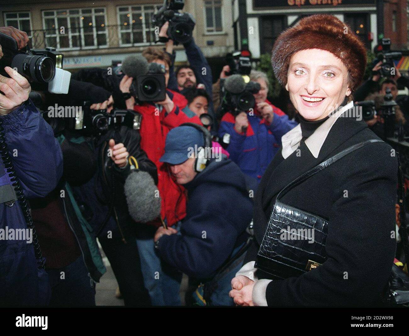 Silvana, estranged wife of Tory MP David Ashby surrounded by the media at the High Court in ...