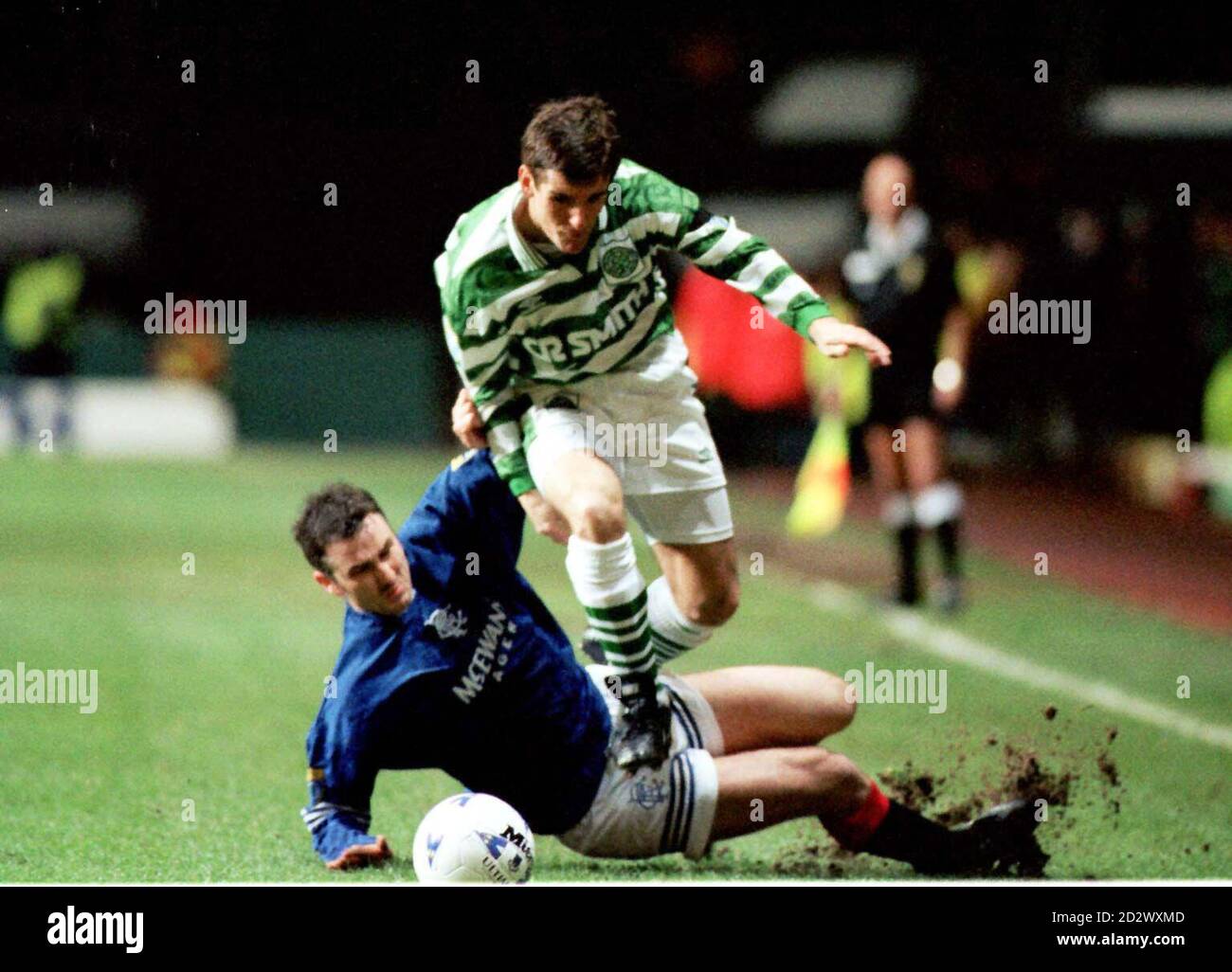 Ranger's Ian Ferguson hits the ground after a tackle with Tom Boyd of ...