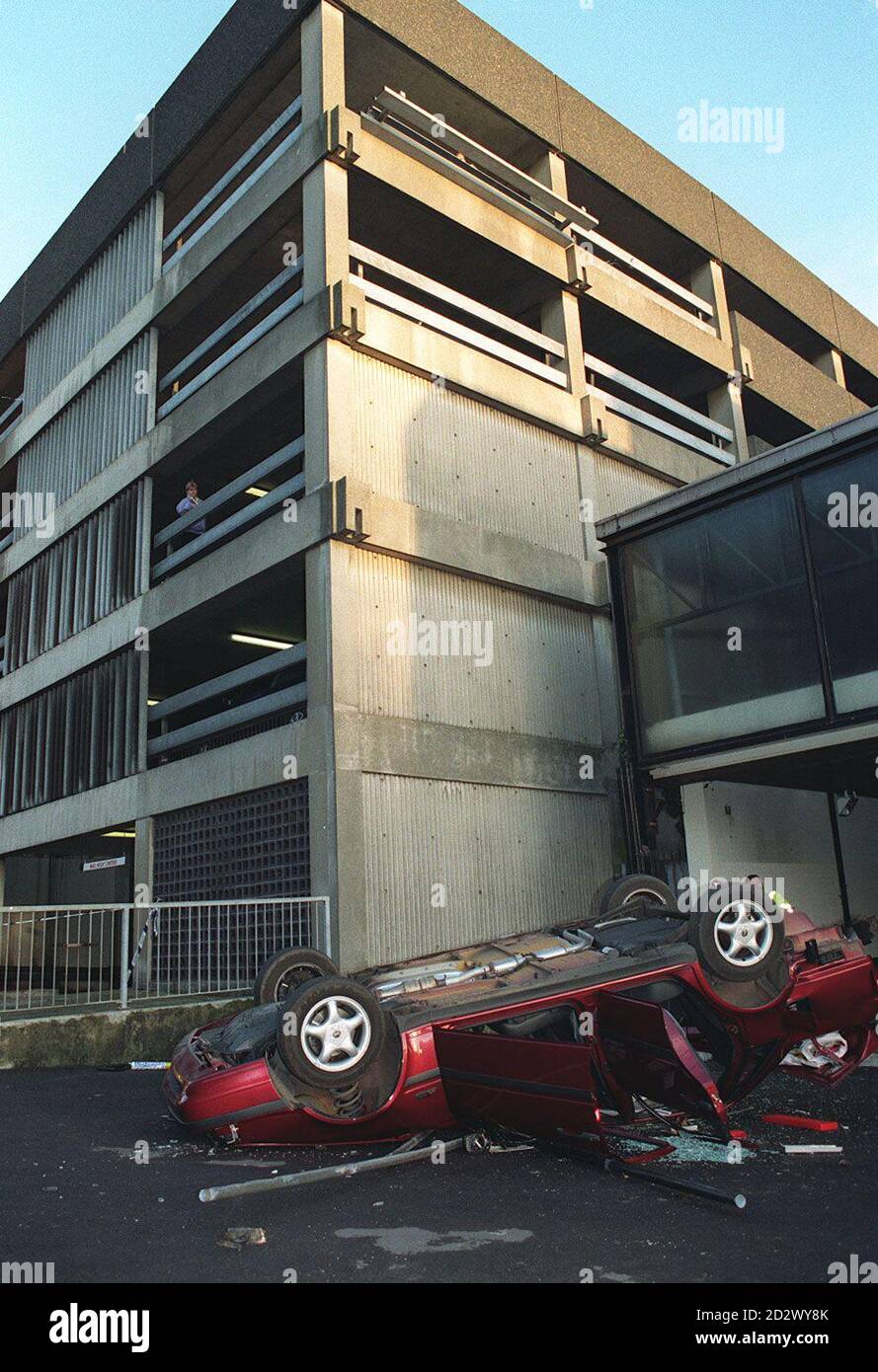 The Volvo car lies crushed at the bottom of a multi-storey car park in ...