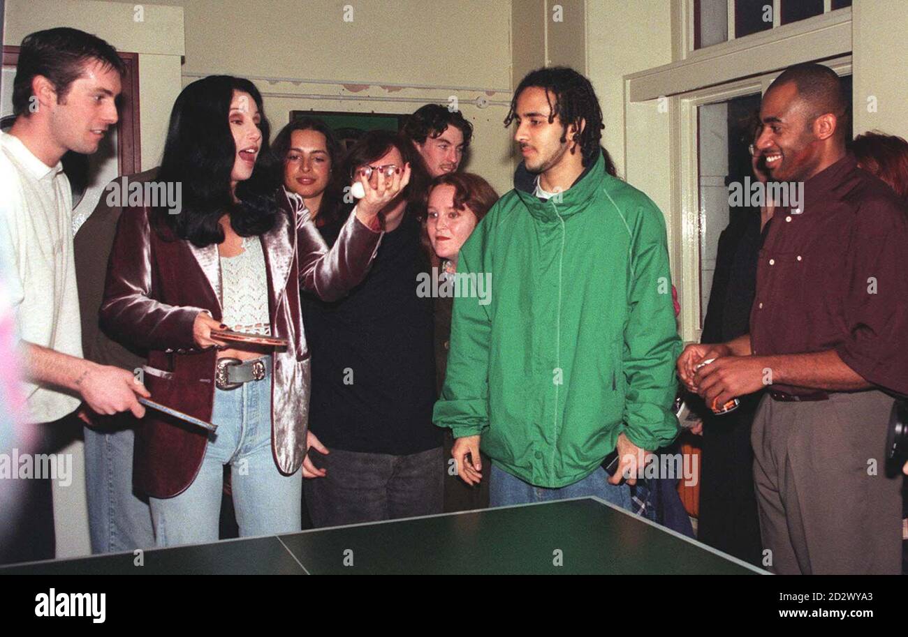 Superstar singer/actress Cher plays table tennis with residents of the ...