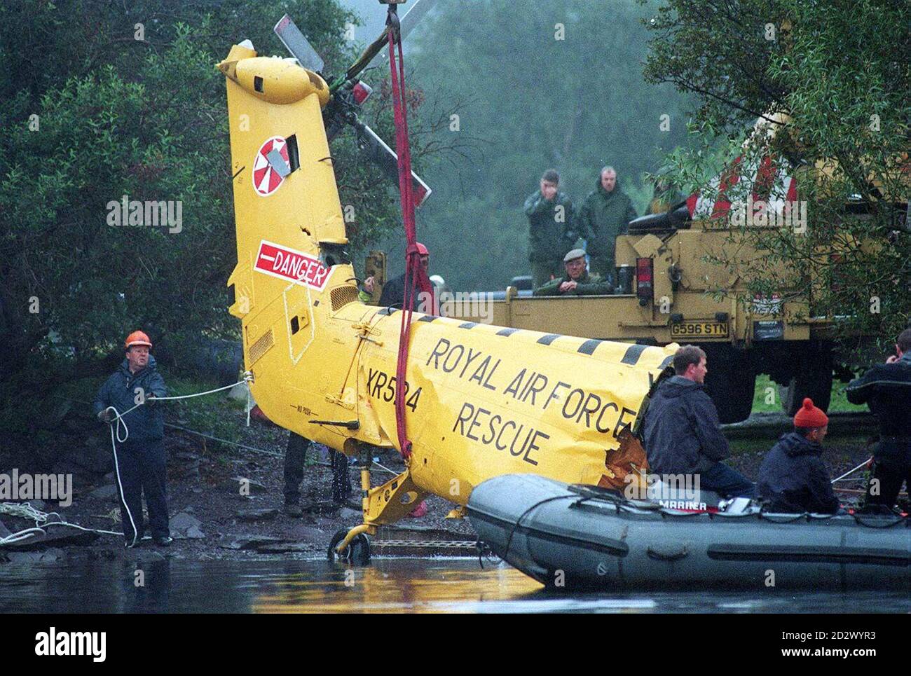 Salvage crews inspecting the scene where a Wessex helicopter crashed ...