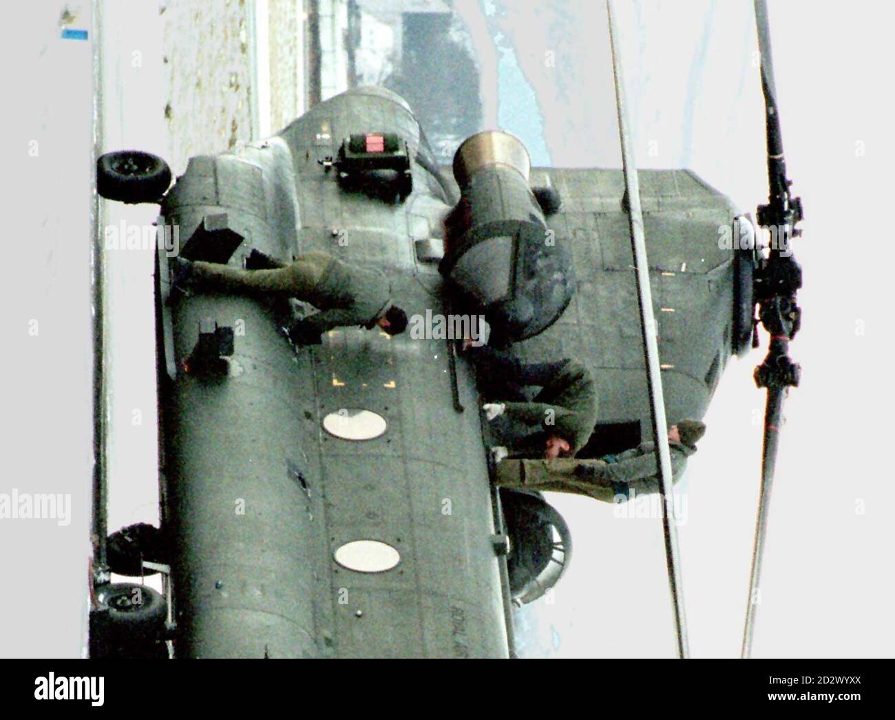 Sir Stephen Young (bending down), the Sheriff conducting the Chinook ...