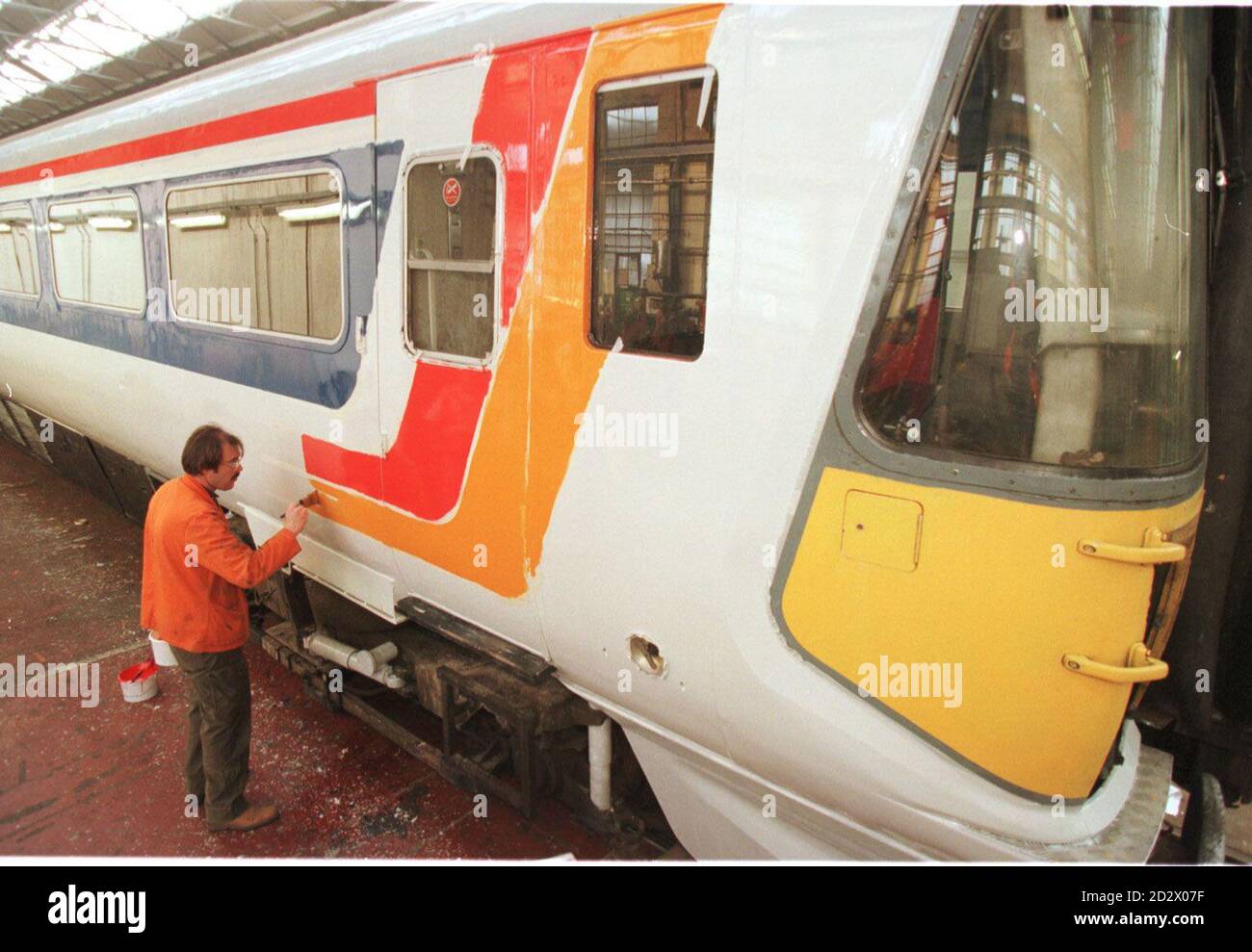 Coach Painter Eddie Cook, from Eastleigh, paints a Class 442 Wessex ...