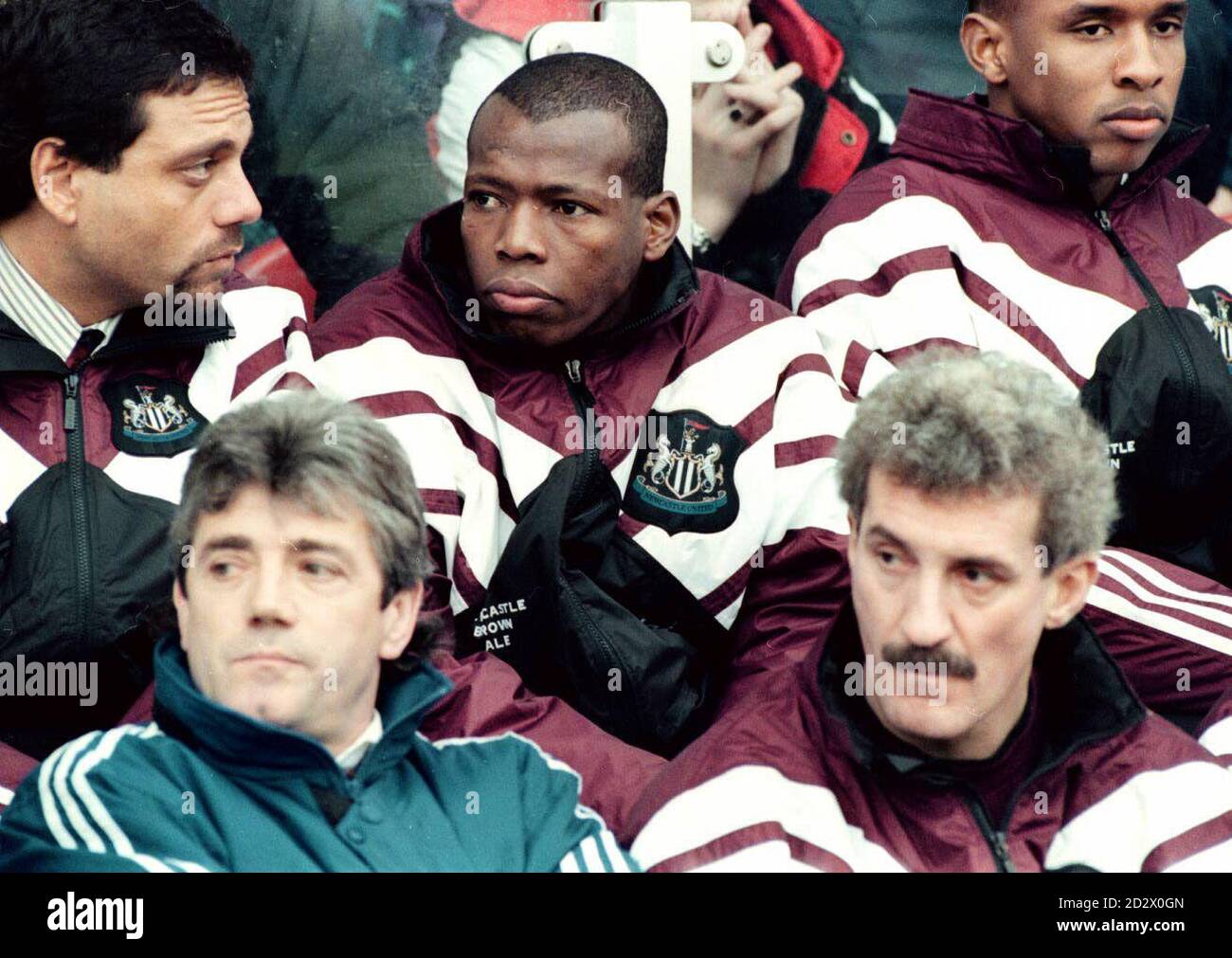 Newcastle's newest signing Faustino Asprilla (centre) sits on the bench ...