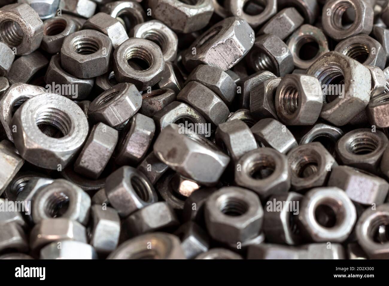 Rusty steel nuts of various sizes Stock Photo - Alamy