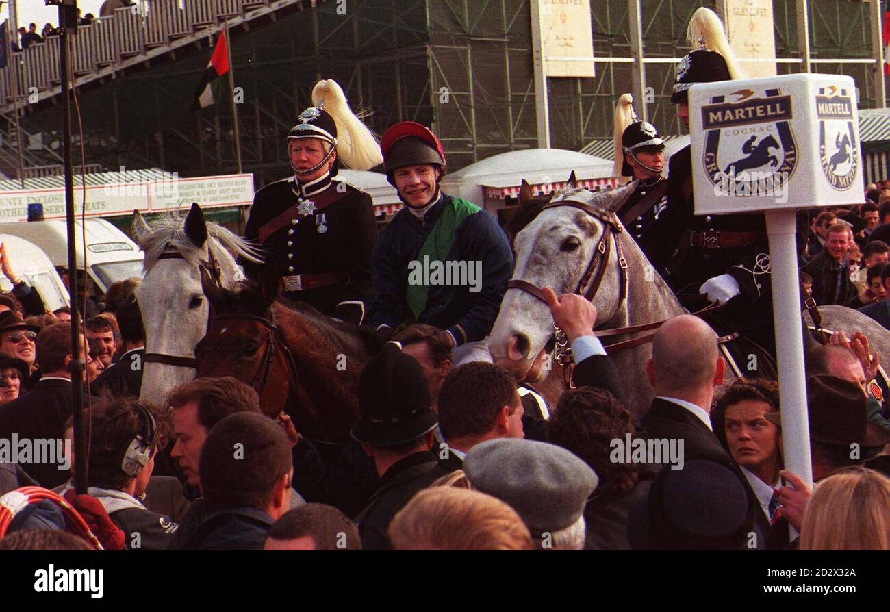 Mike Fitzgerald riding the Grand National winner Rough Quest is led in ...