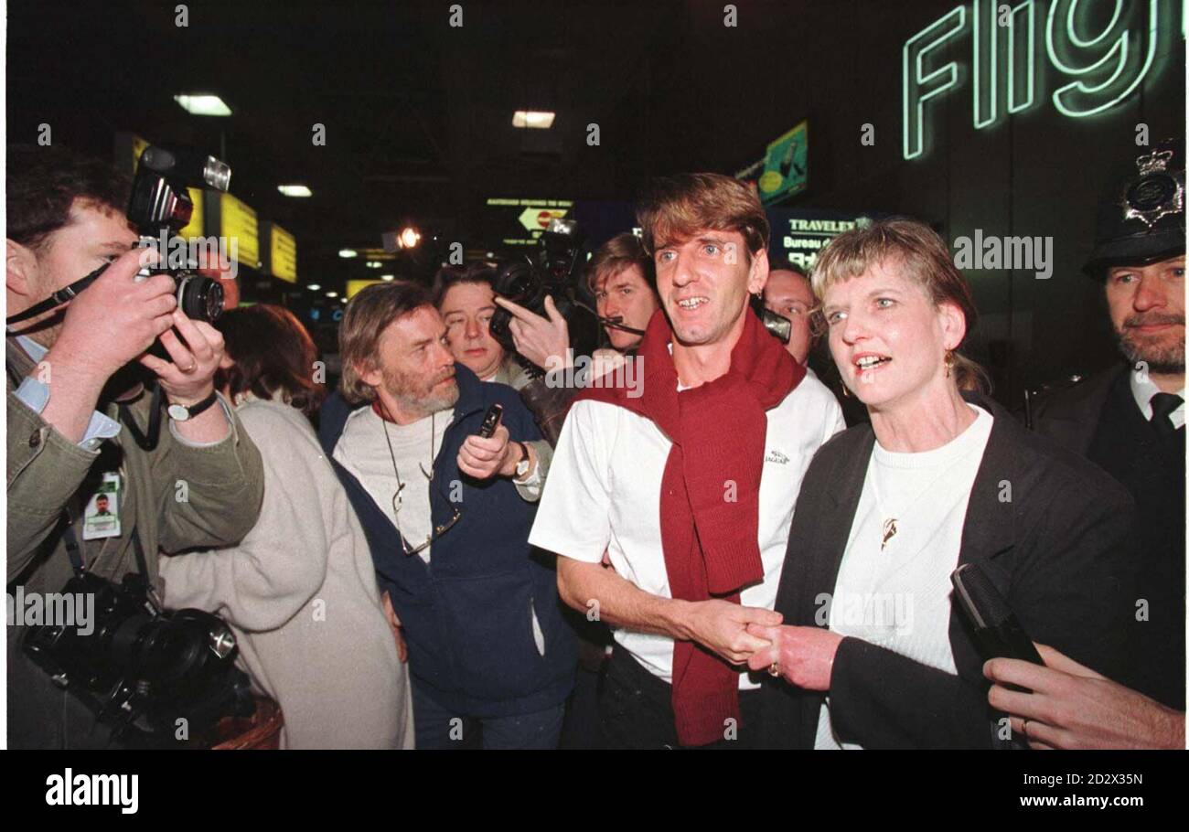 Robert Lock is greeted by his mother Lynda at Heathrow Airport when he arrived from Bangkok ...