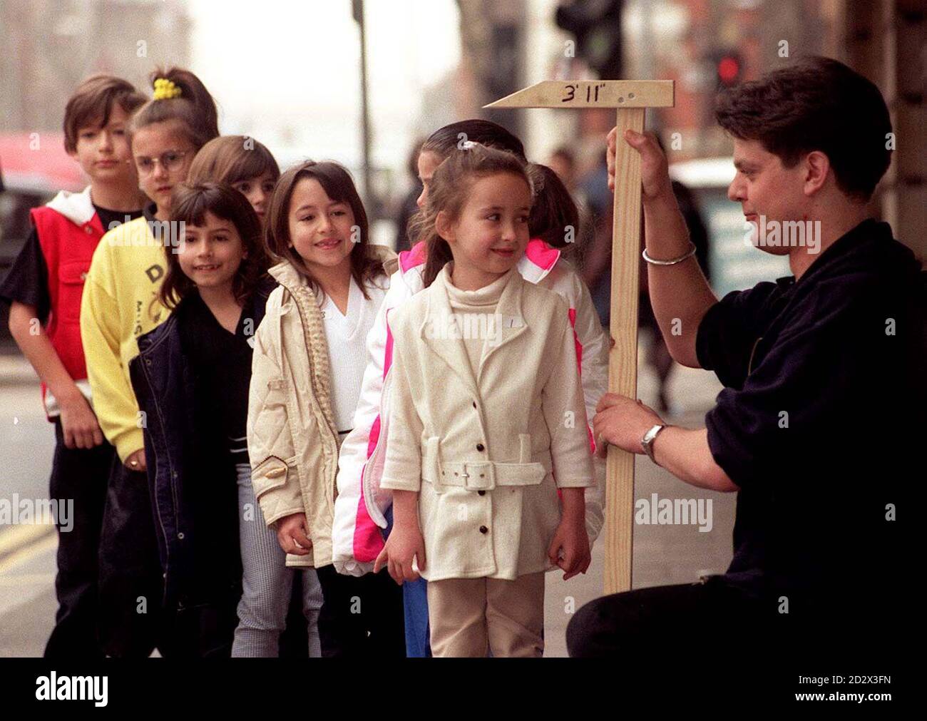 Six-year-old Maria Herrett, from Medway, Kent, is measured up for a ...