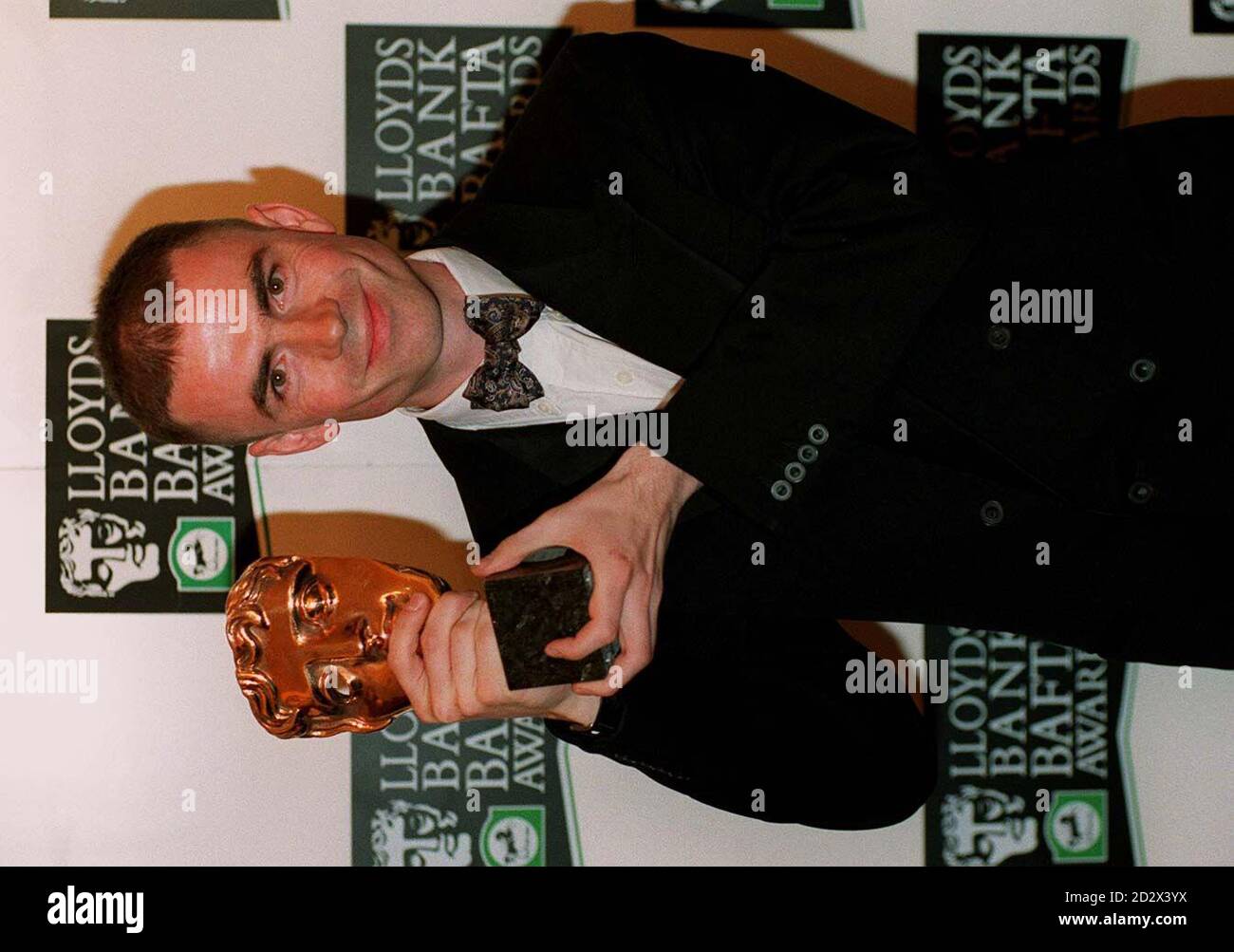John Hodge after receiving his award for Best screenplay (adapted) for ...
