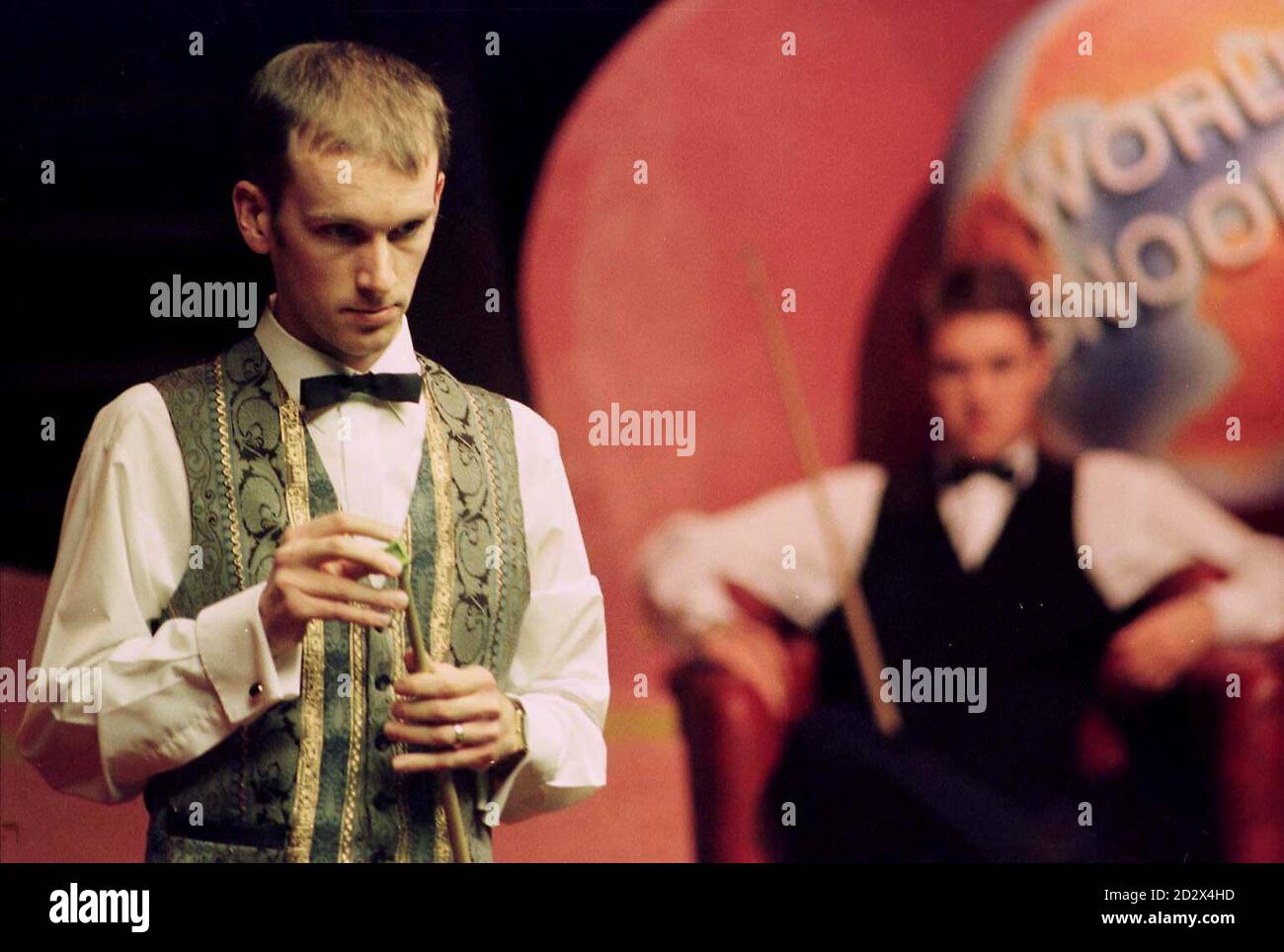 Peter Ebden looks in toughtful mood as Stephen Hendry sits back during ...