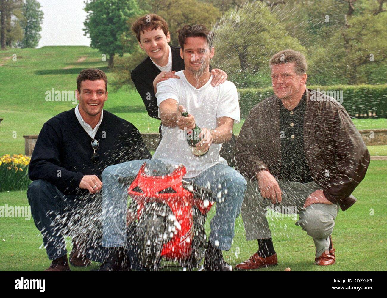 Twenty three-year-old Karl Crompton sprays the bubbly around after he ...
