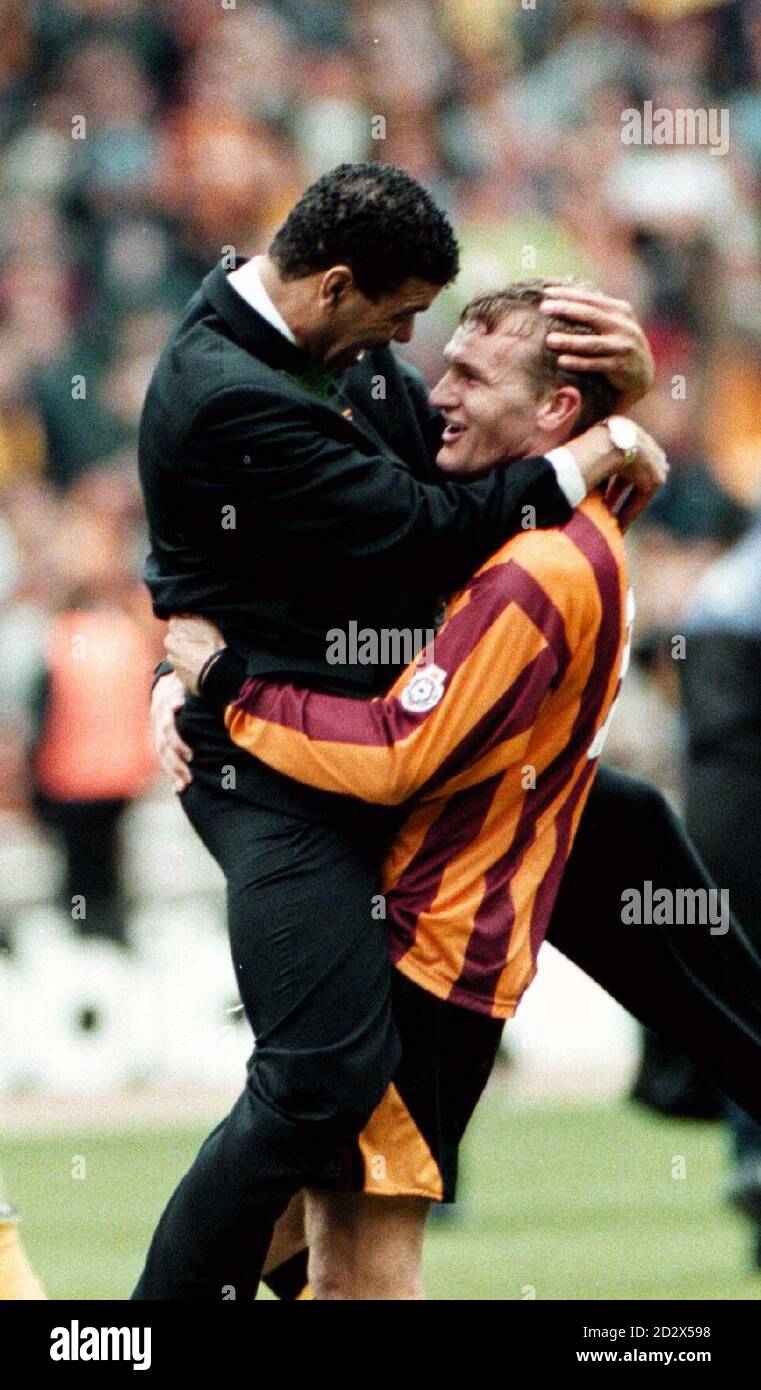 Bradford City manager Chris Kamara hugs Captain Eddie Youds after ...