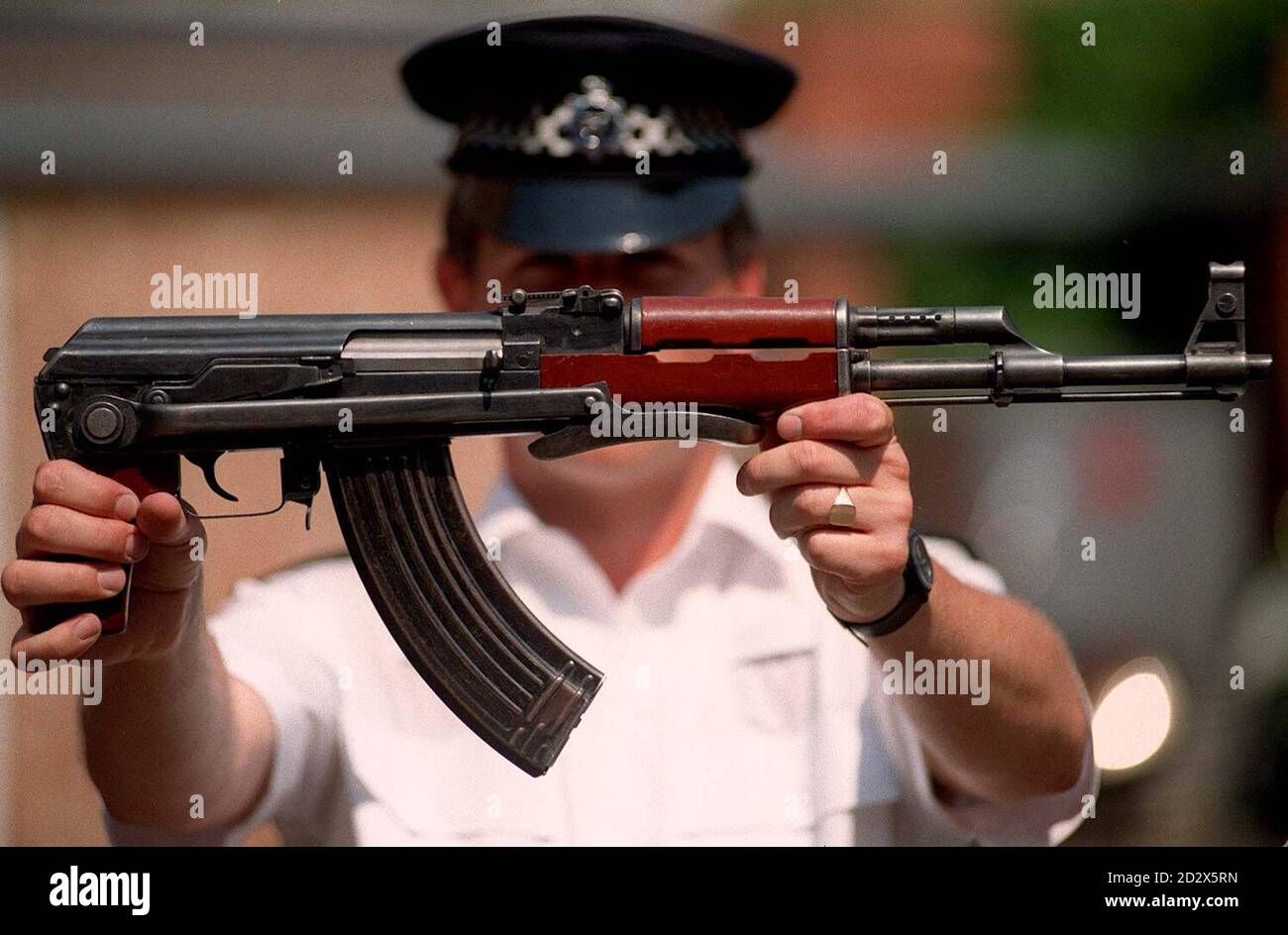 Sgt Andy Lawrence displays the AK47 Russian Assault Rifle handed in to ...