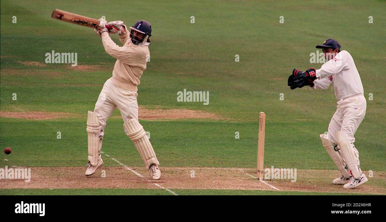 Wicket keeper Nayan Mongia leaps as Jack Russell knocks a four during ...