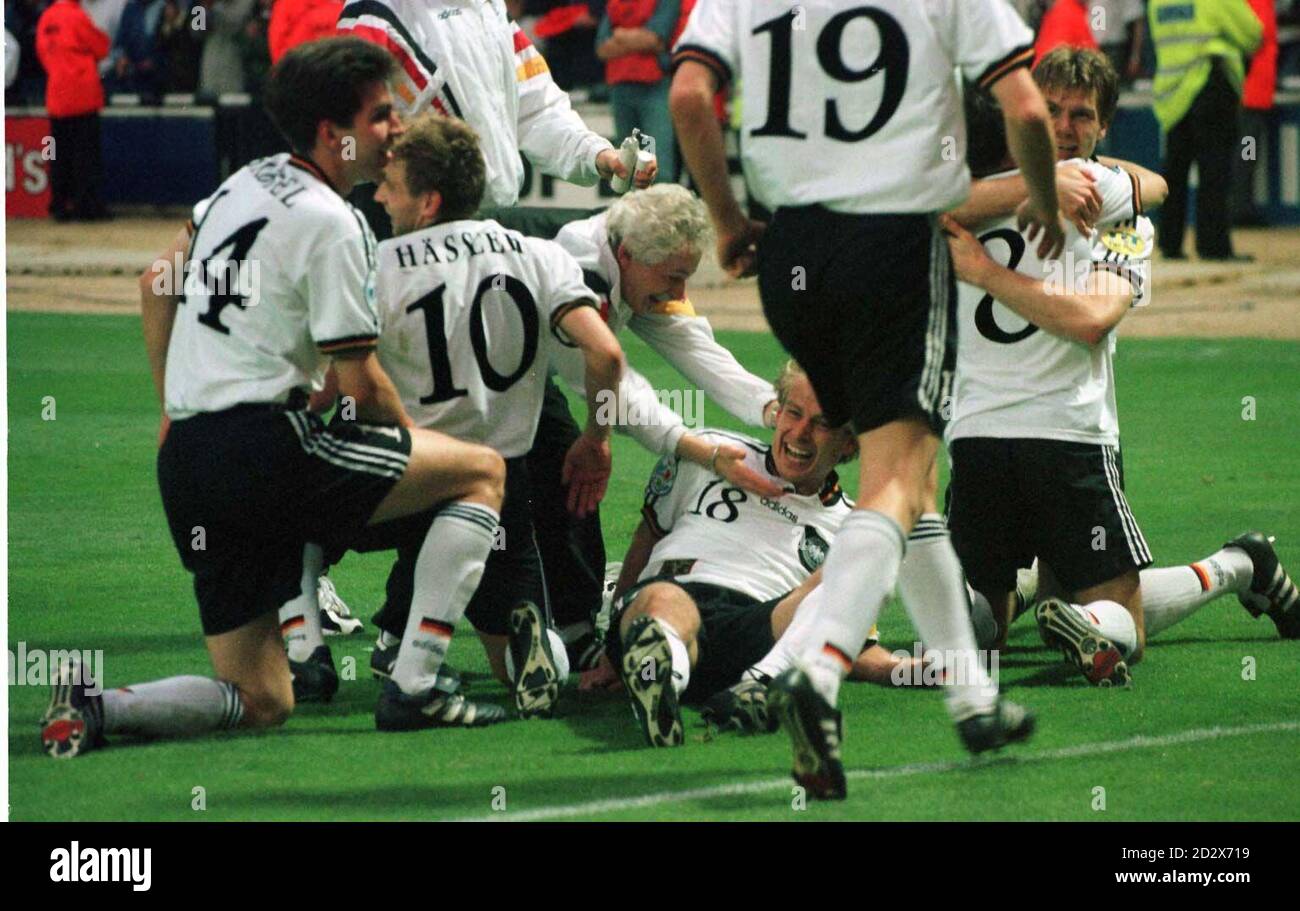 Jurgen Klinsmann (18) celebrates with teammates after Germany's 2-1 ...