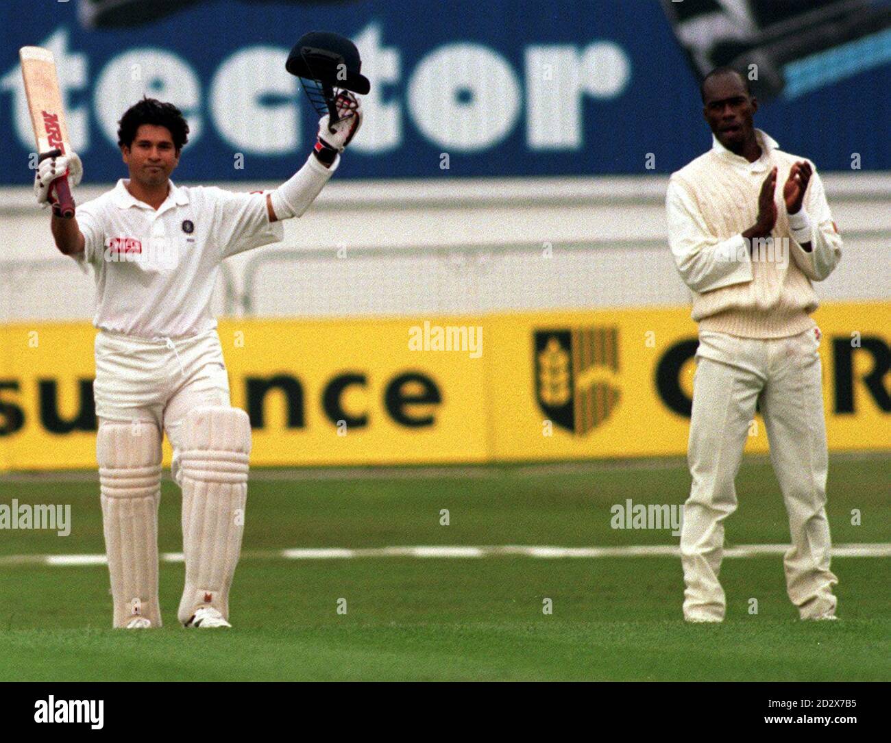 England bowler Chris Lewis applauds Indian batsman Sachin Tendulkar who ...