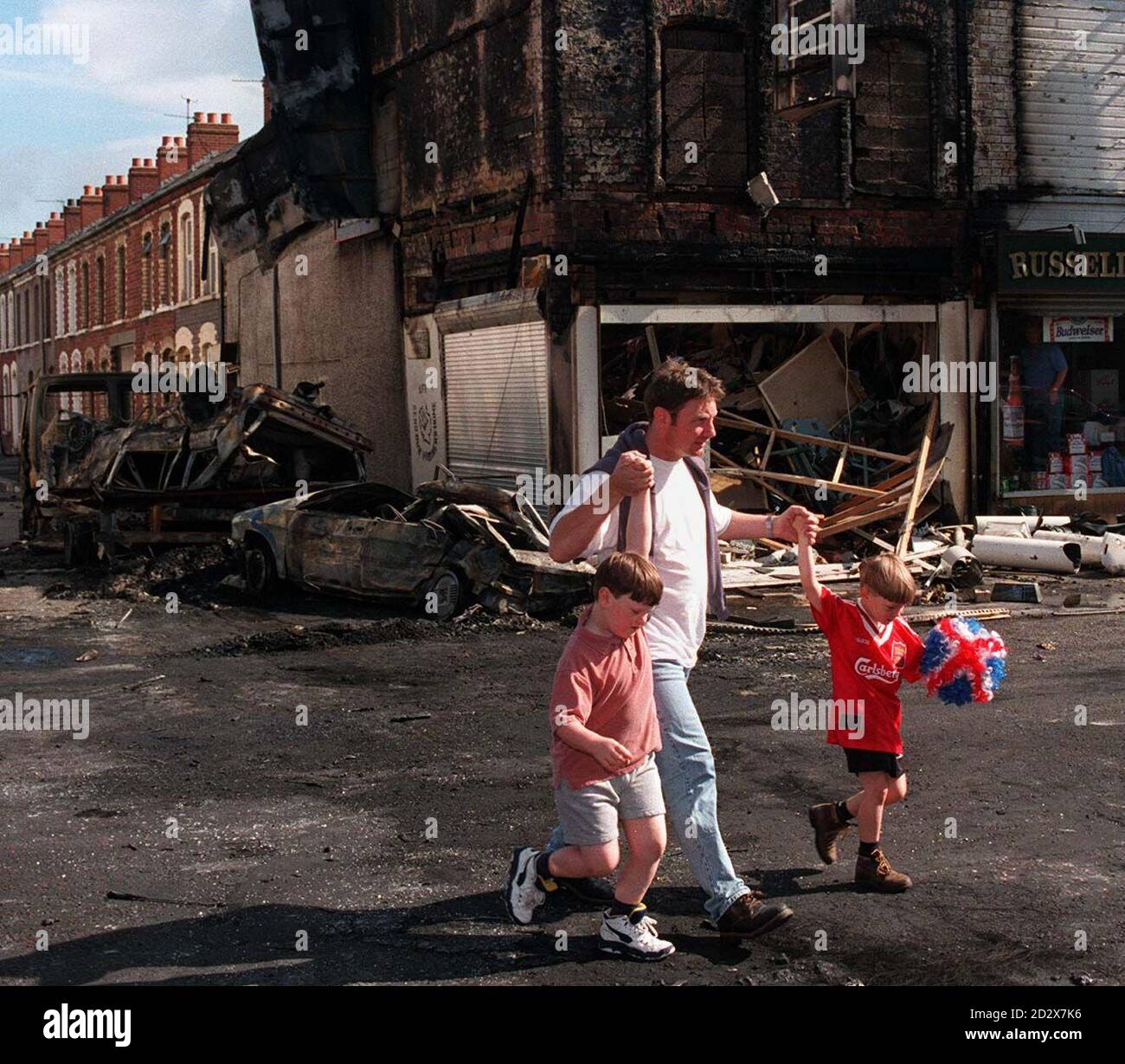 Showing the colours as a youngster with a loyalist wig crosses the ...