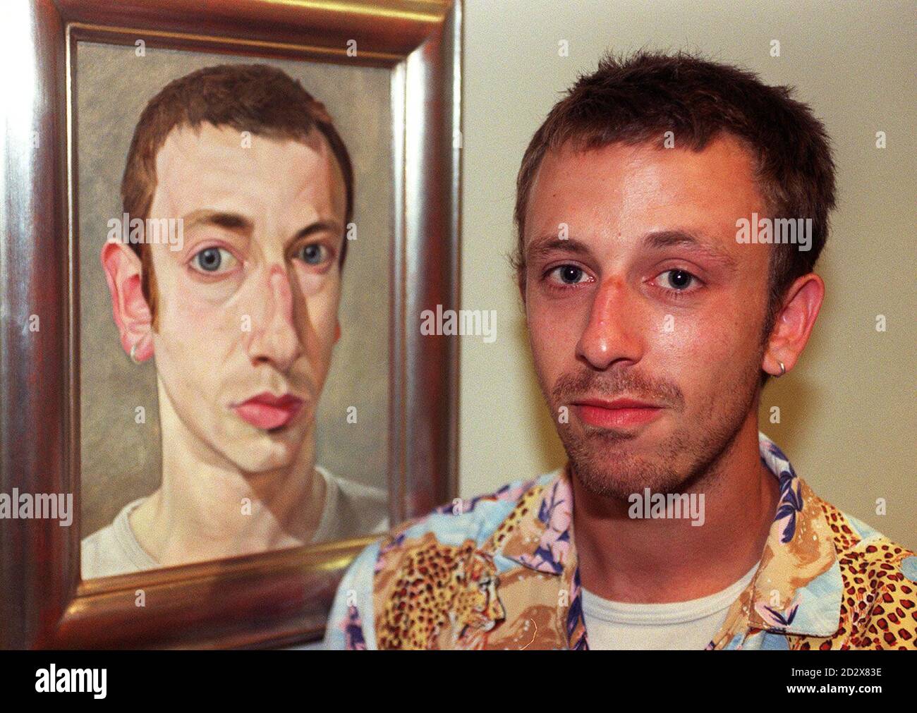 Artist James Hague with his winning entry in this year's BP Portrait ...