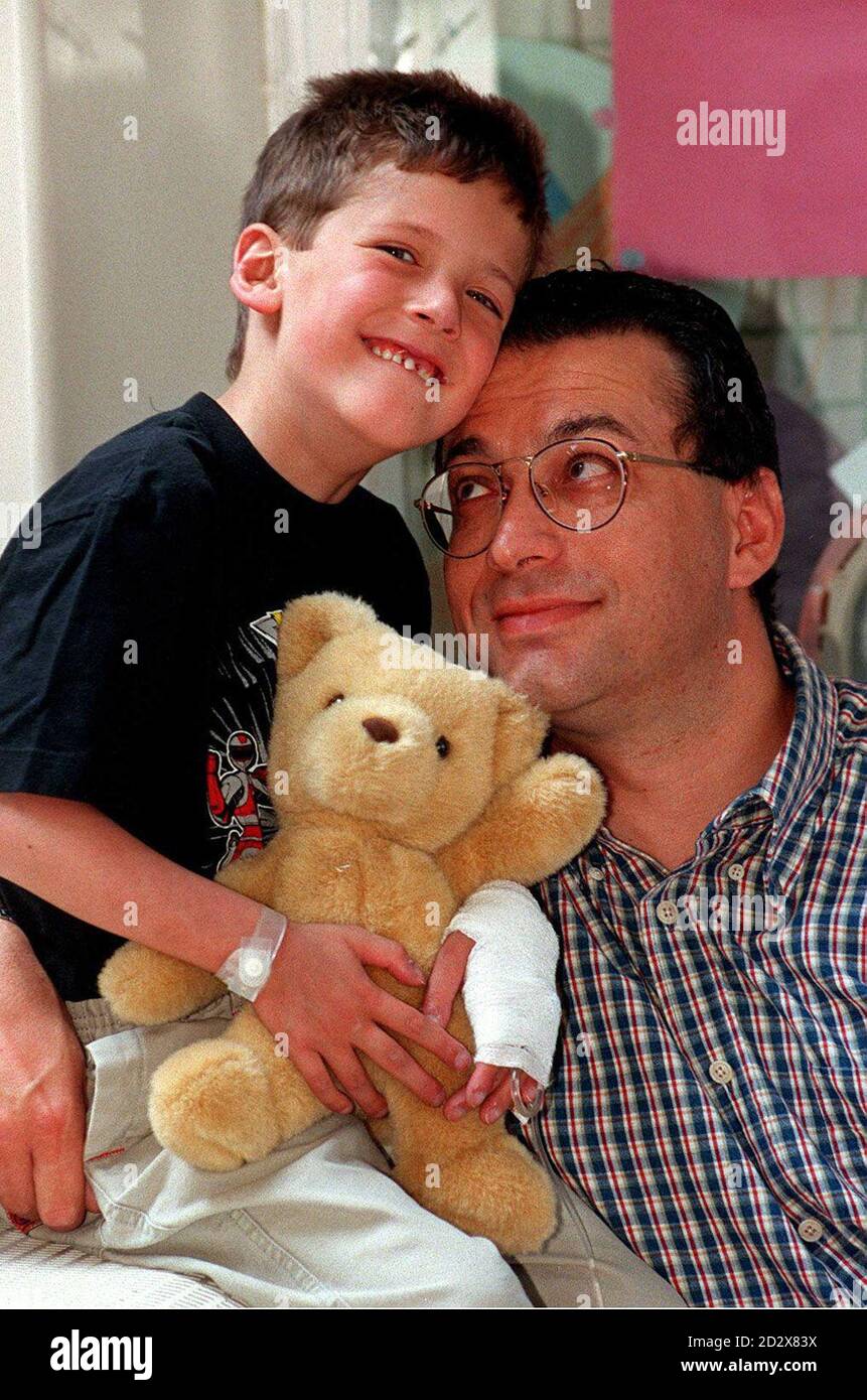 Robert Plotnek (6), from Edgbaston, Birmingham, waits with his father ...