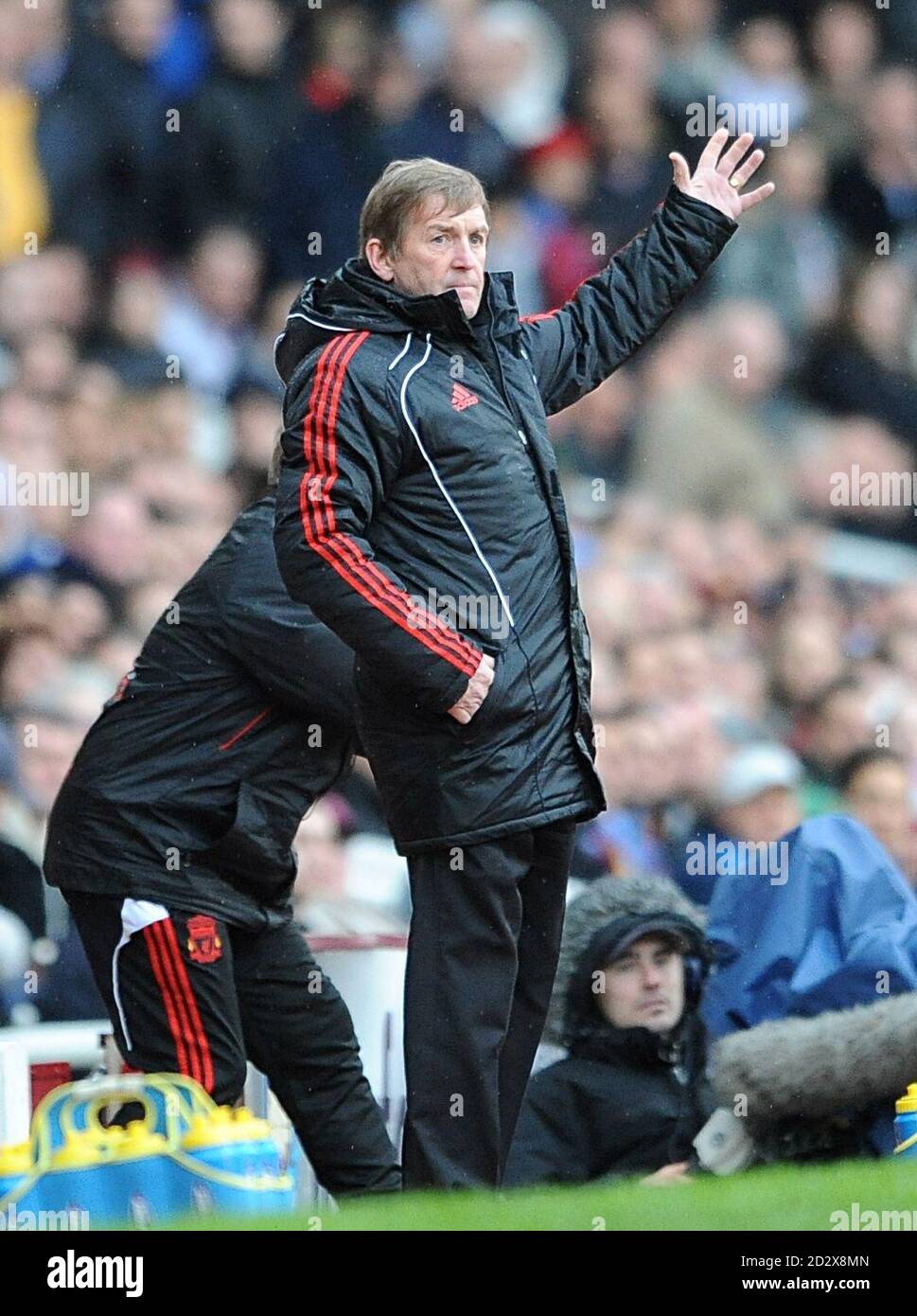 Liverpool manager Kenny Dalglish gestures from the touchline Stock ...