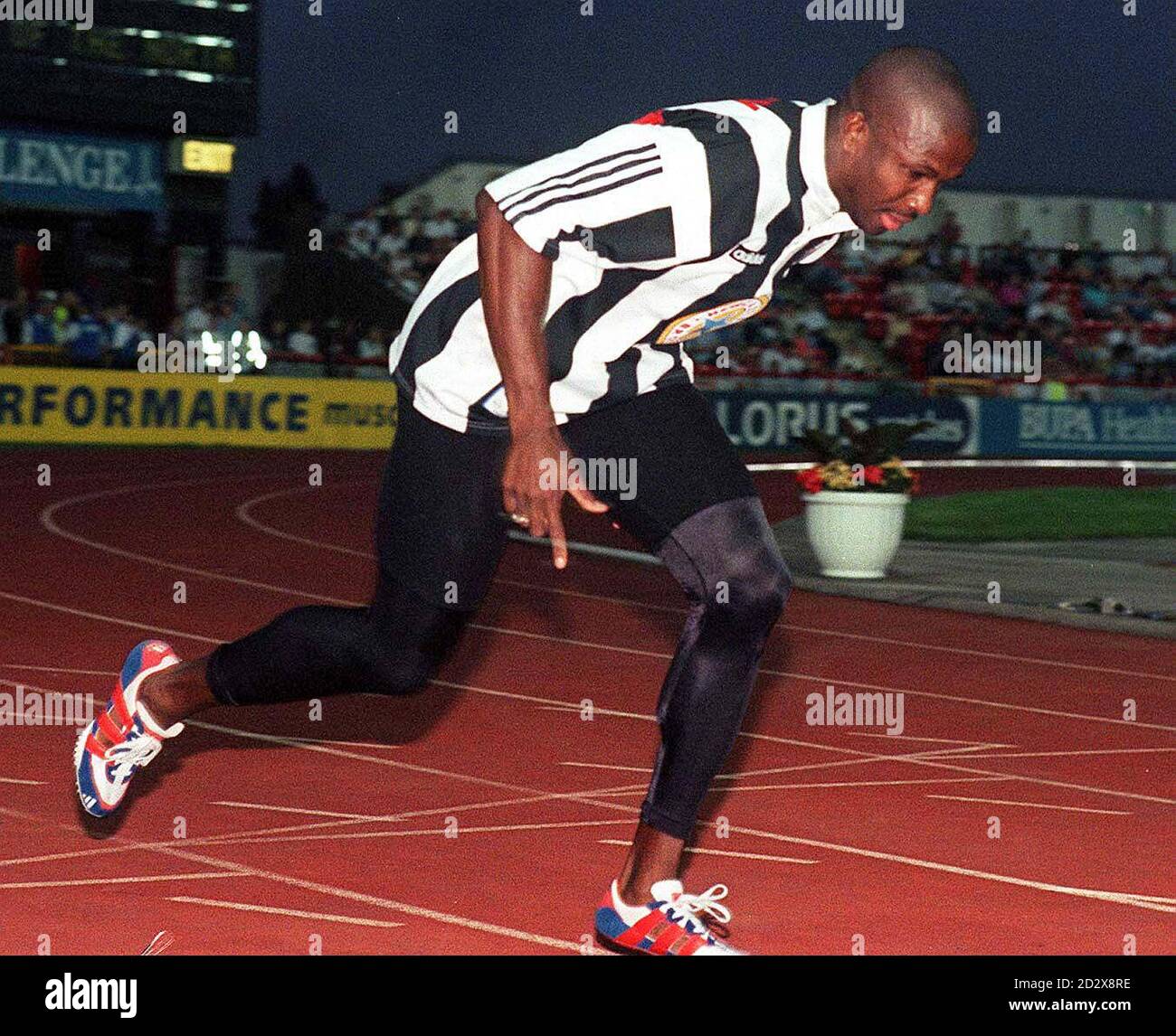 Canadian sprinter Donovan Bailey warming-up in a Newcastle United shirt ...