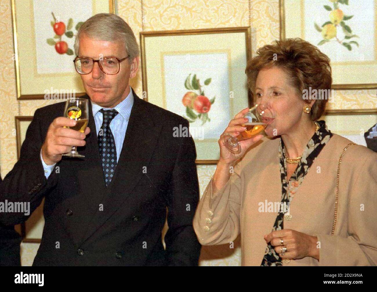 Prime Minister John Major and his wife Norma sample glasses of cider ...