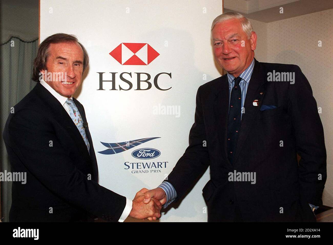 Sir William Purves, chair of the HSBC financial group, shakes hands ...