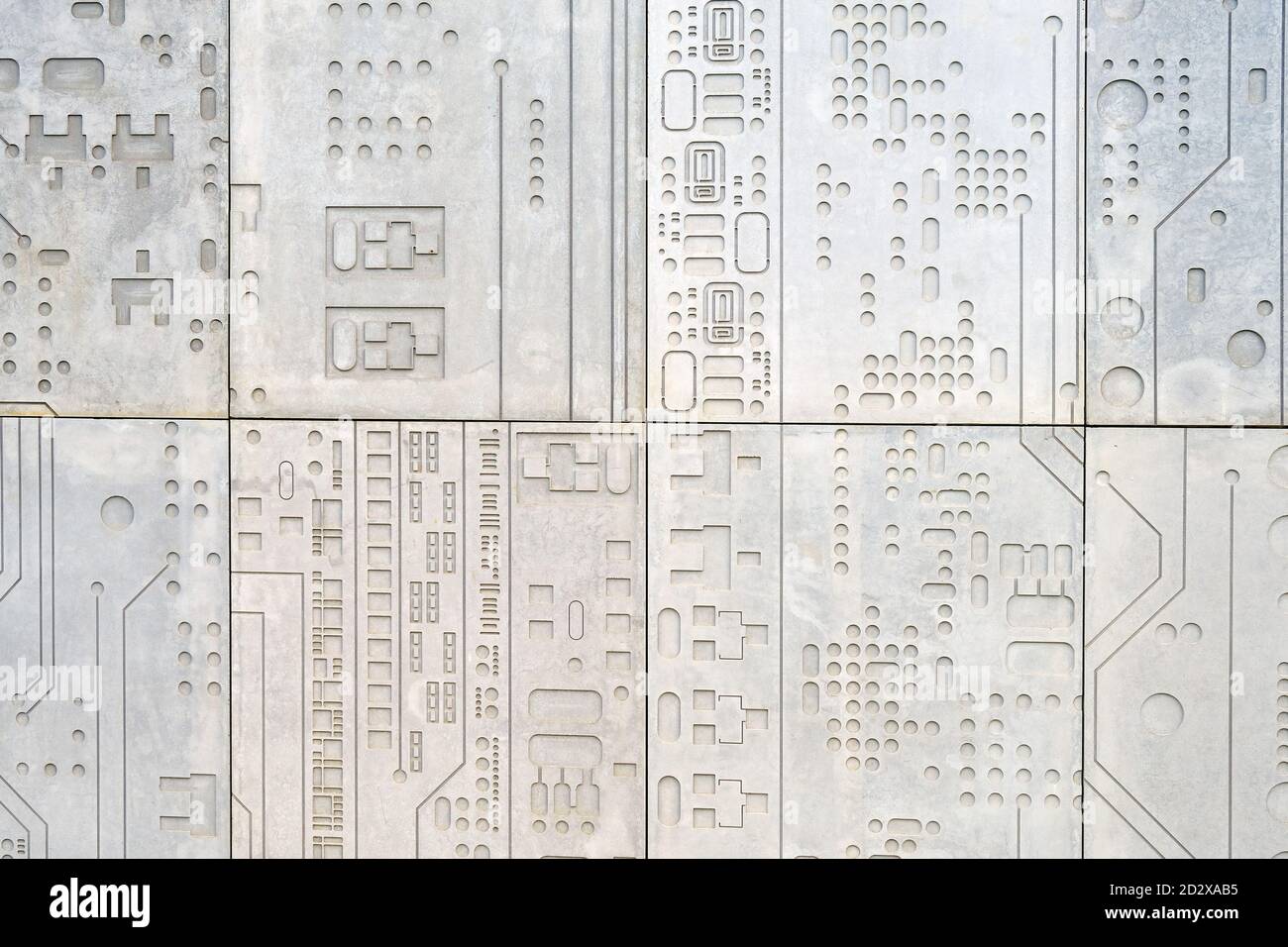 Concrete wall background with a print of a computer chip, modern ...