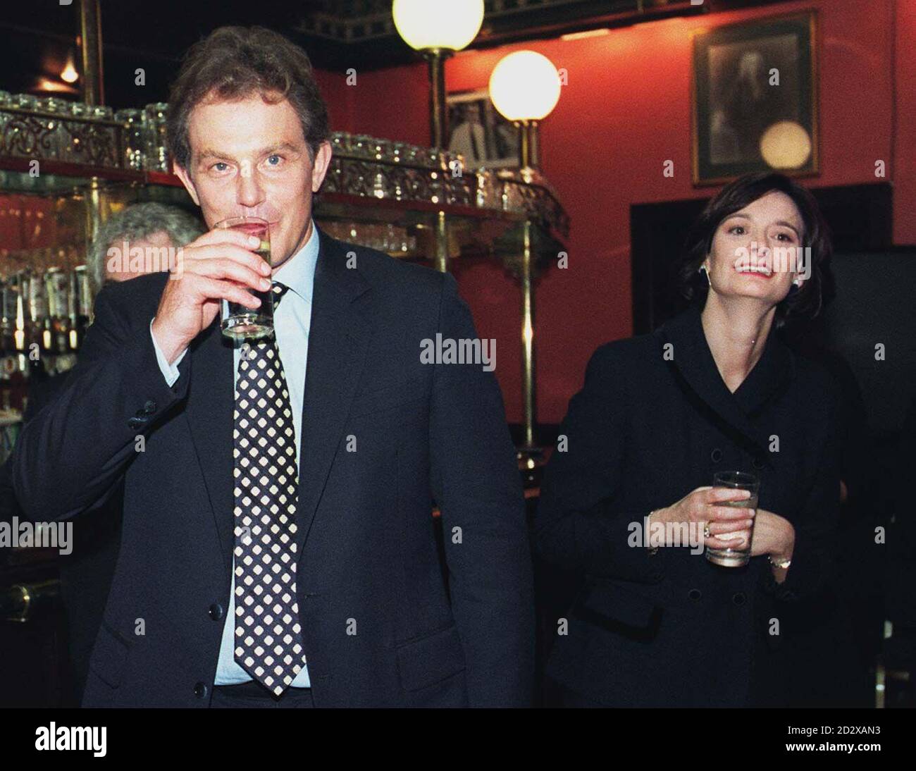 Tony Blair and his wife Cherie Booth relax with a drink after his ...