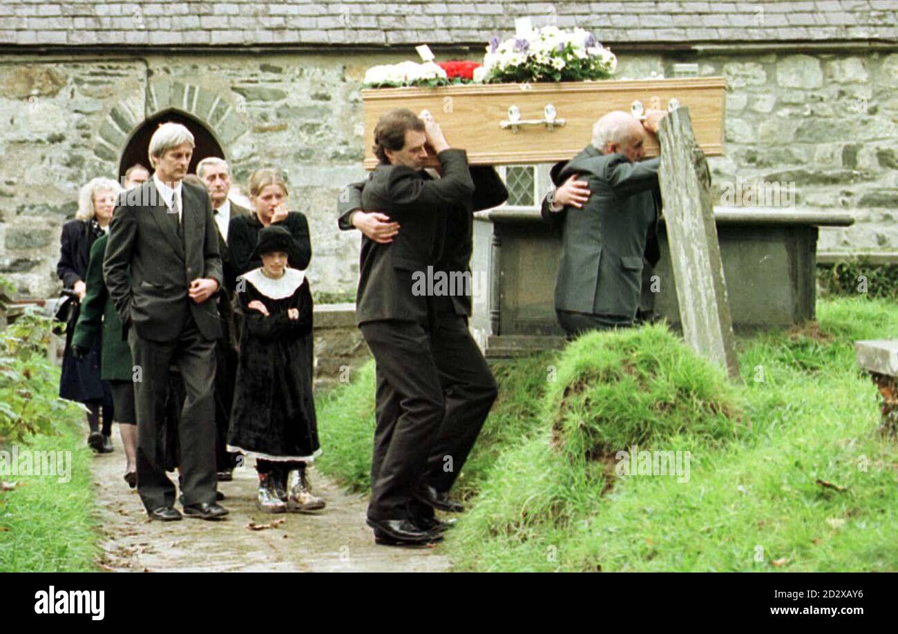Dr Shaun Russell and daughter Josie follow one of the two coffins to ...