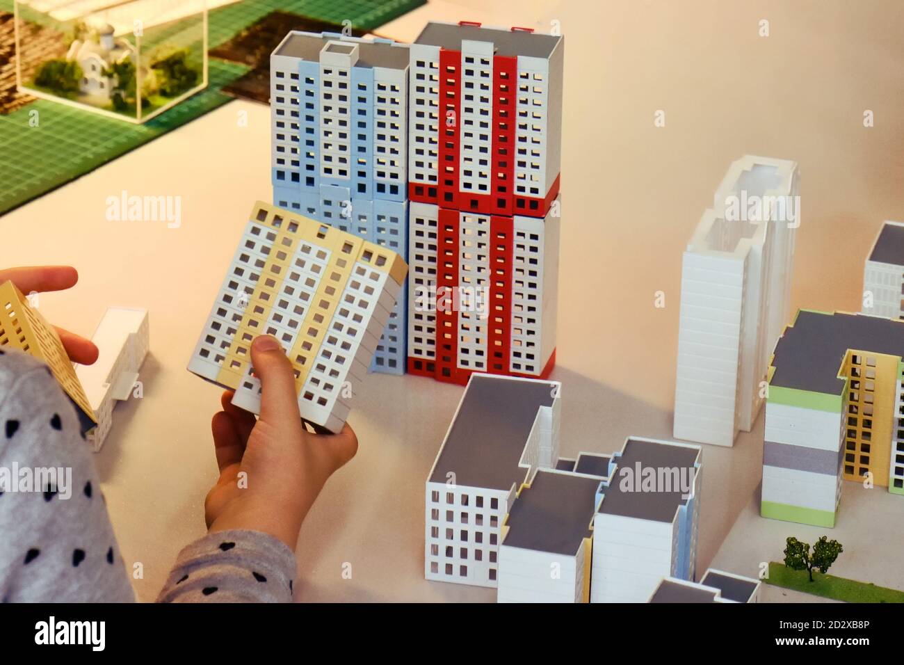 A child builds a city street from toy houses Stock Photo - Alamy