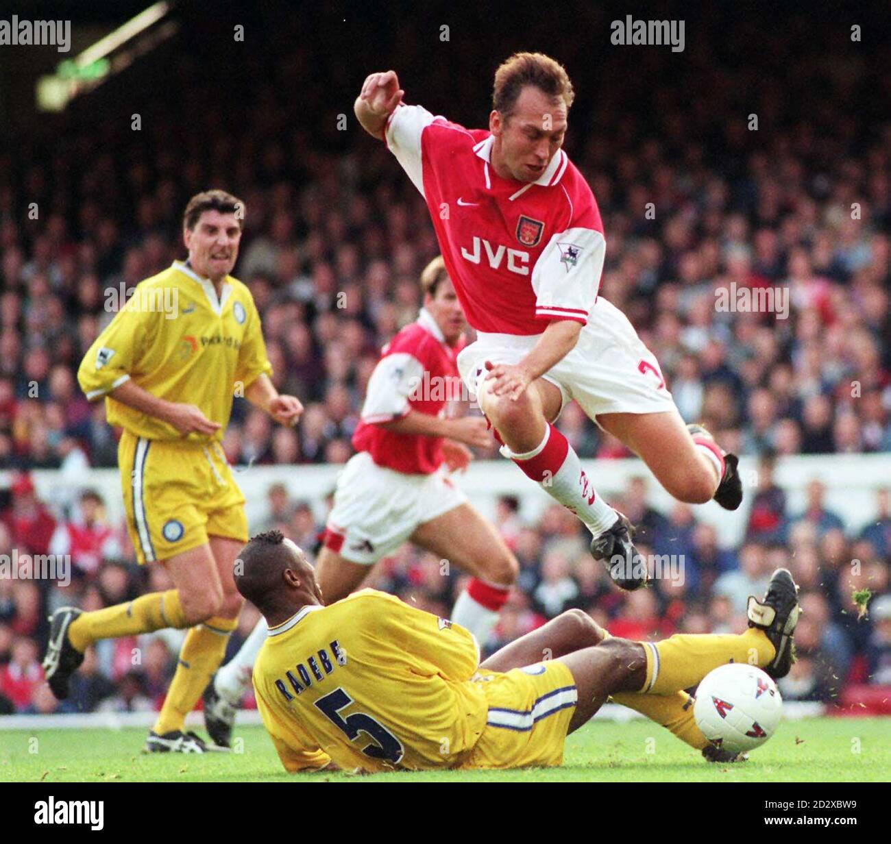 Arsenal's David Platt gets airborne as he forces forward during today's ...
